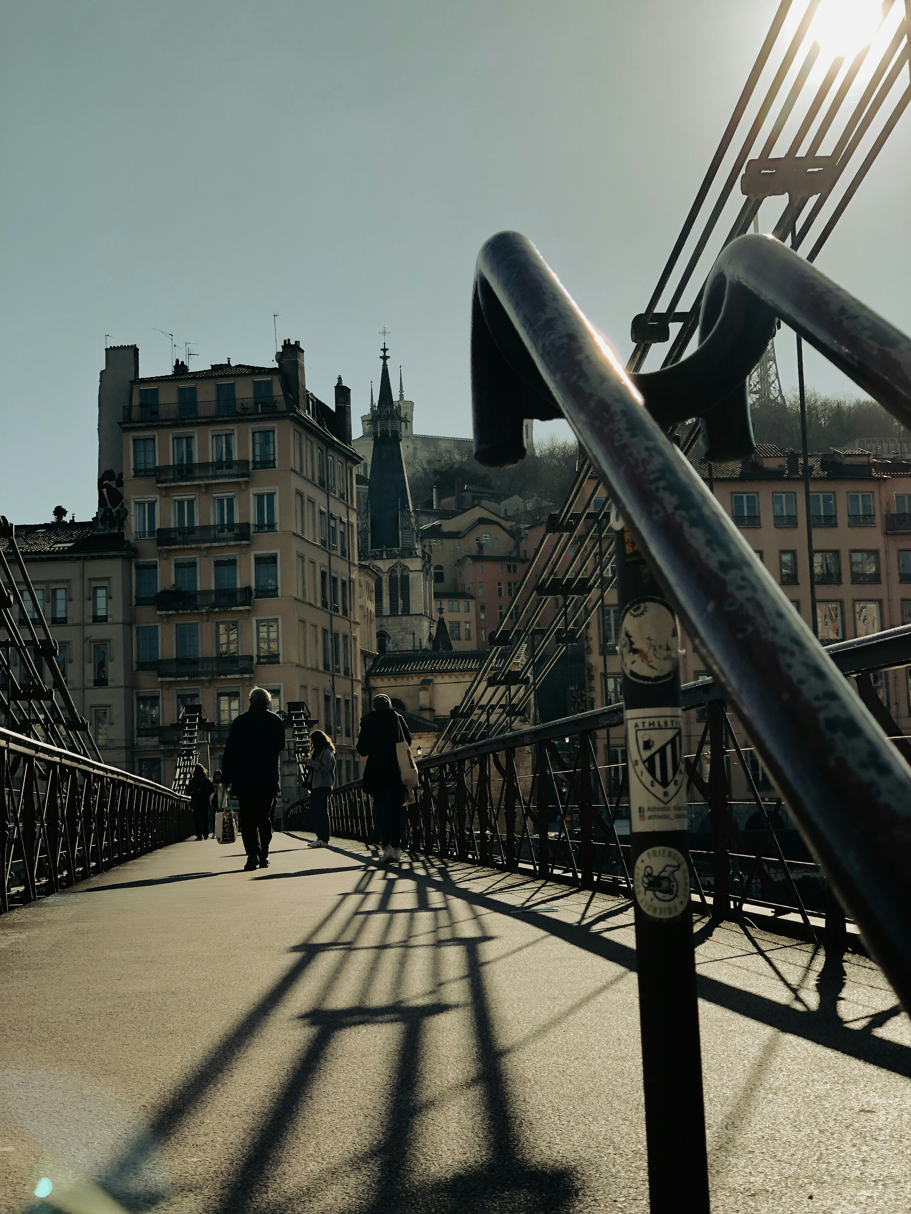 A group of people walking across a bridge photo – Free Lyon Image on ...