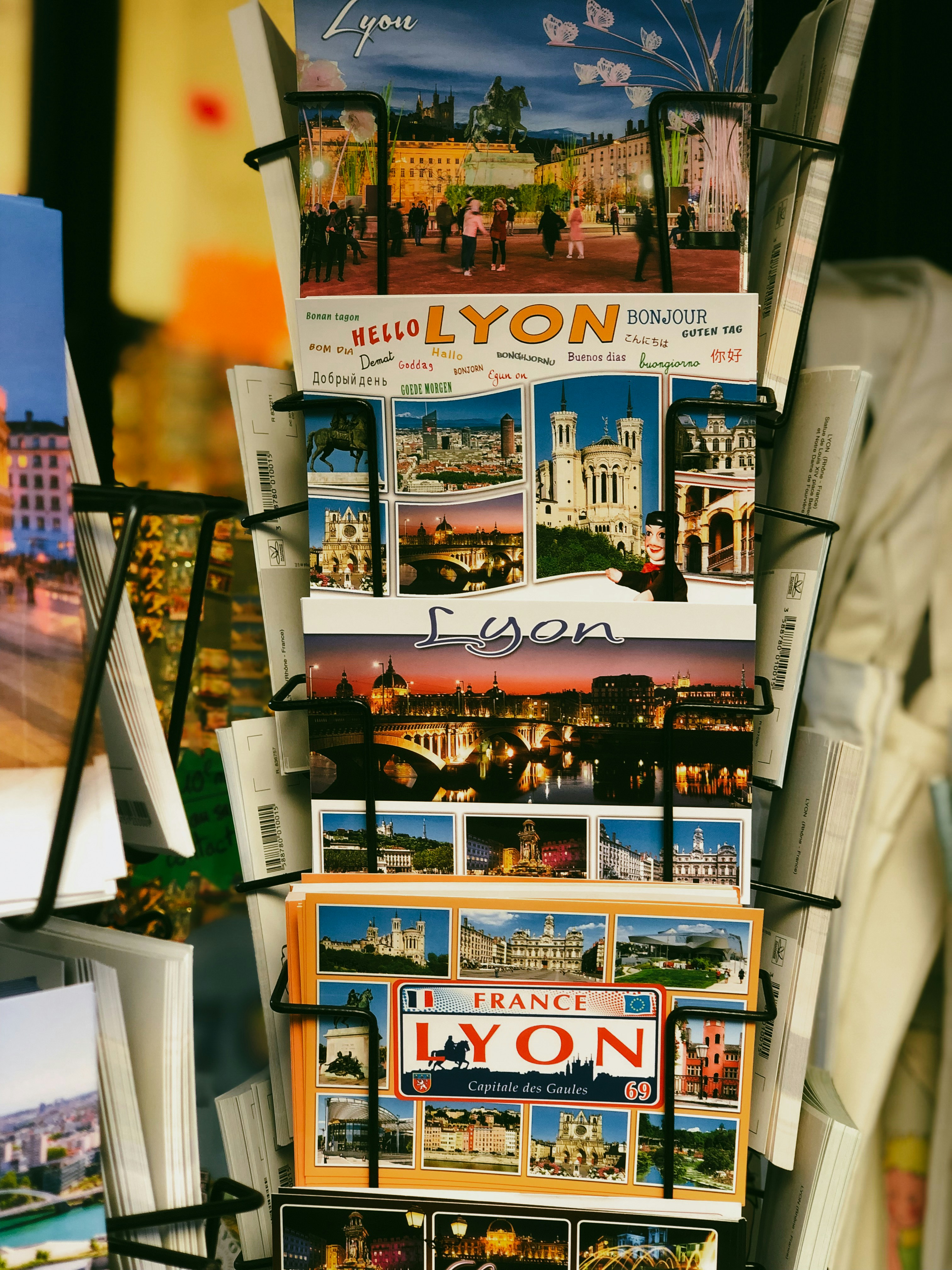 A bunch of brochures are stacked on a rack photo – Free Lyon Image on ...
