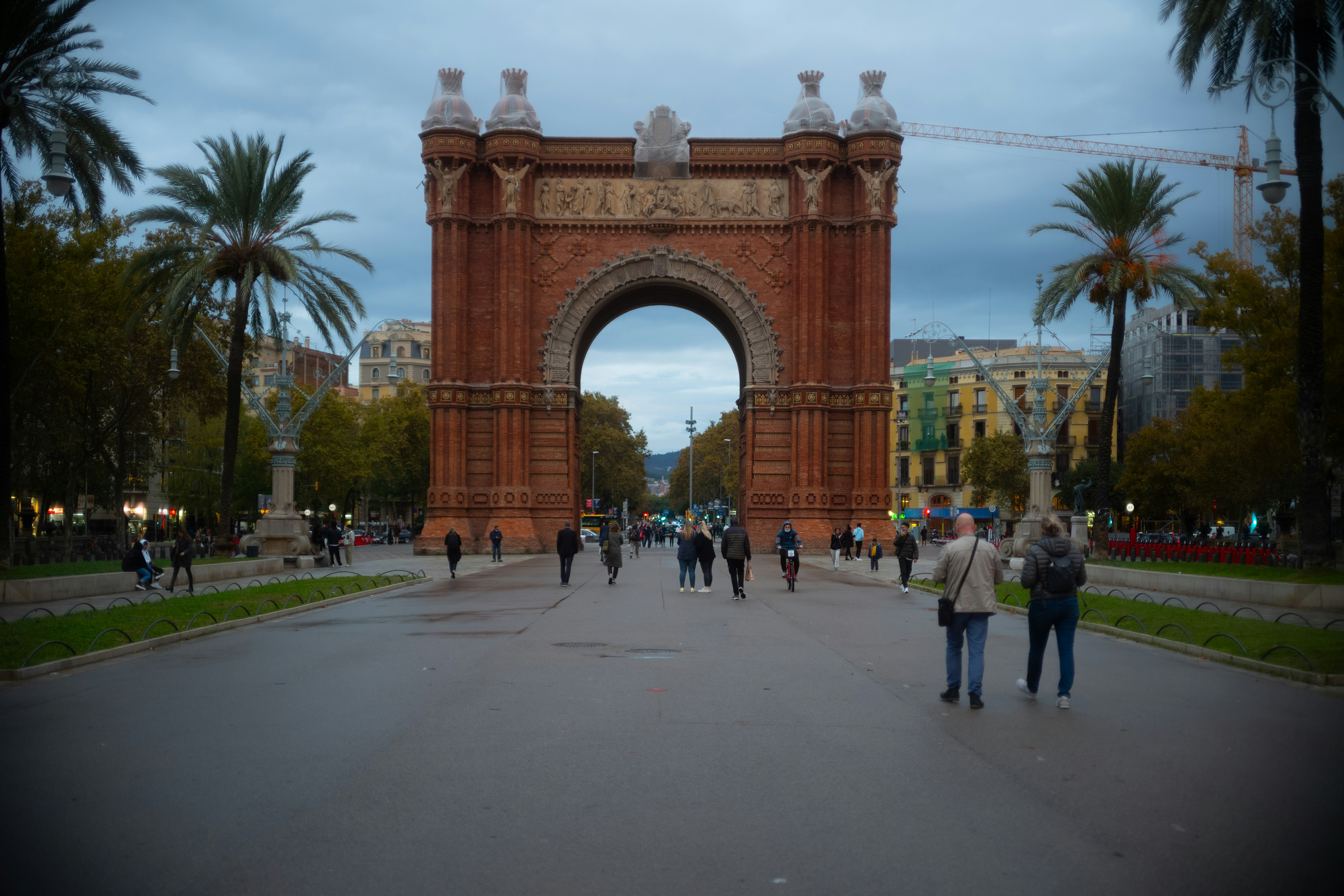 A group of people standing in front of a tall gate photo – Free Gates ...