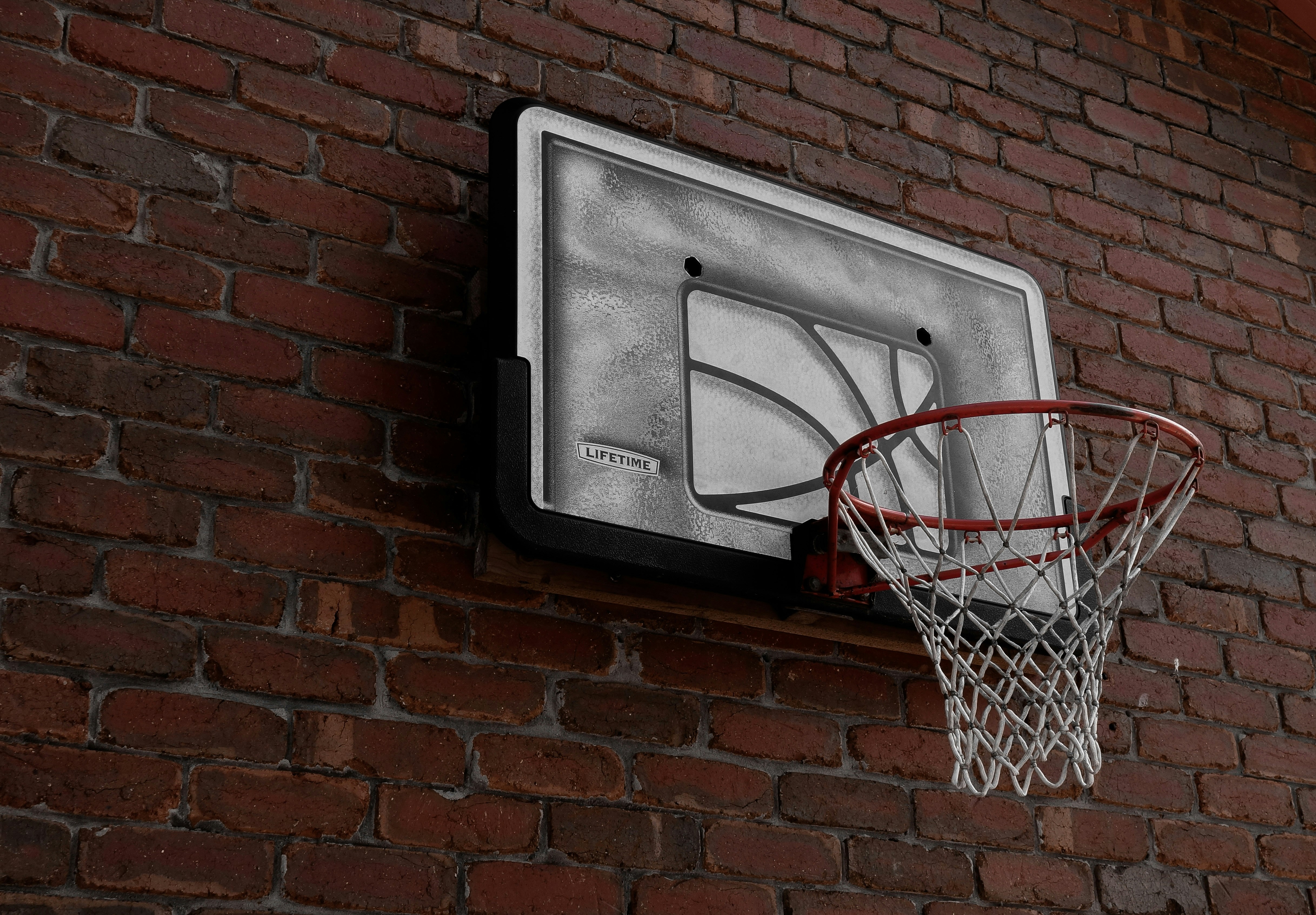 A basketball hoop mounted to a brick wall photo – Free Melbourne Image ...