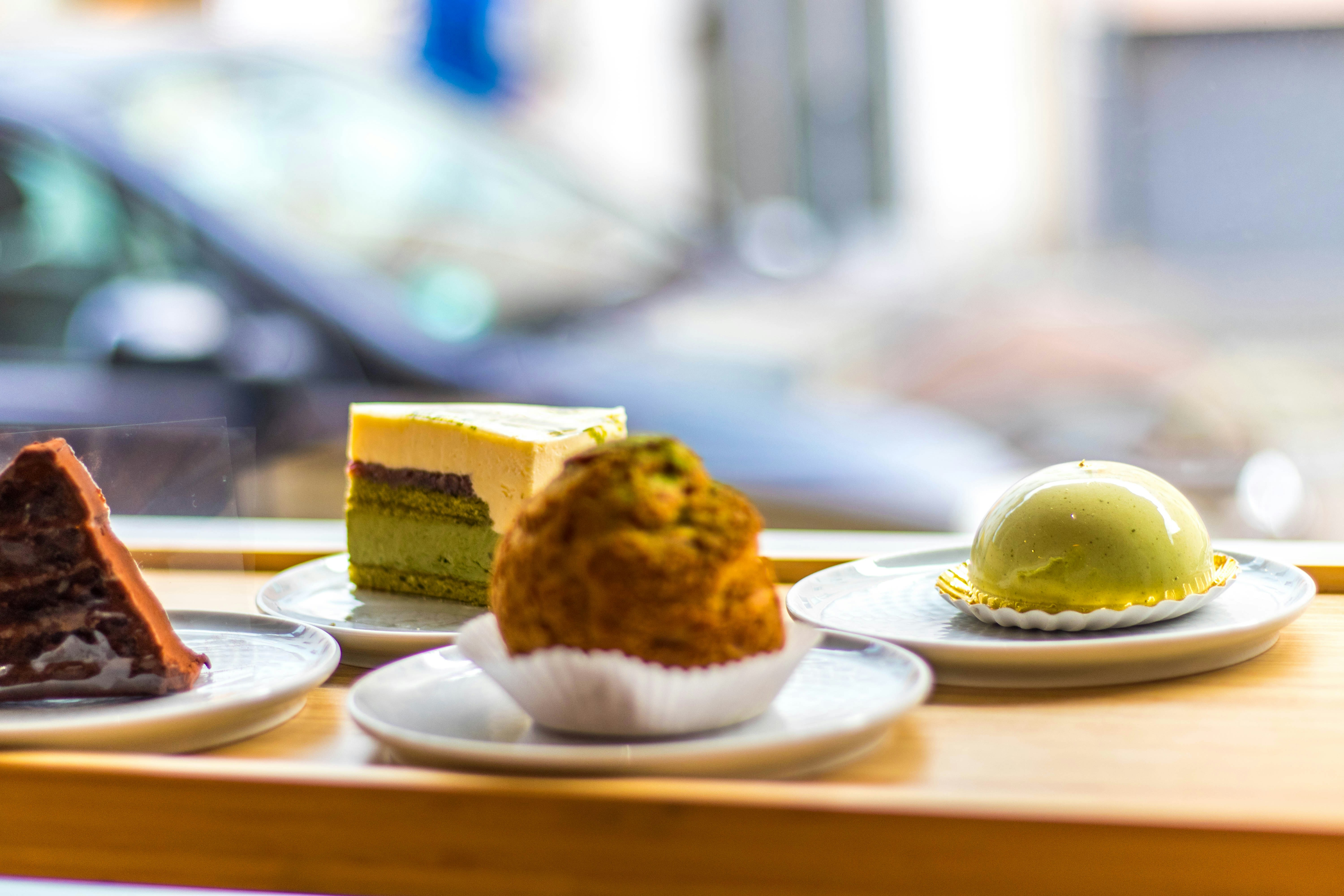 Soft-Focus Café Pastries: A Row of Treats on a Sunny Counter