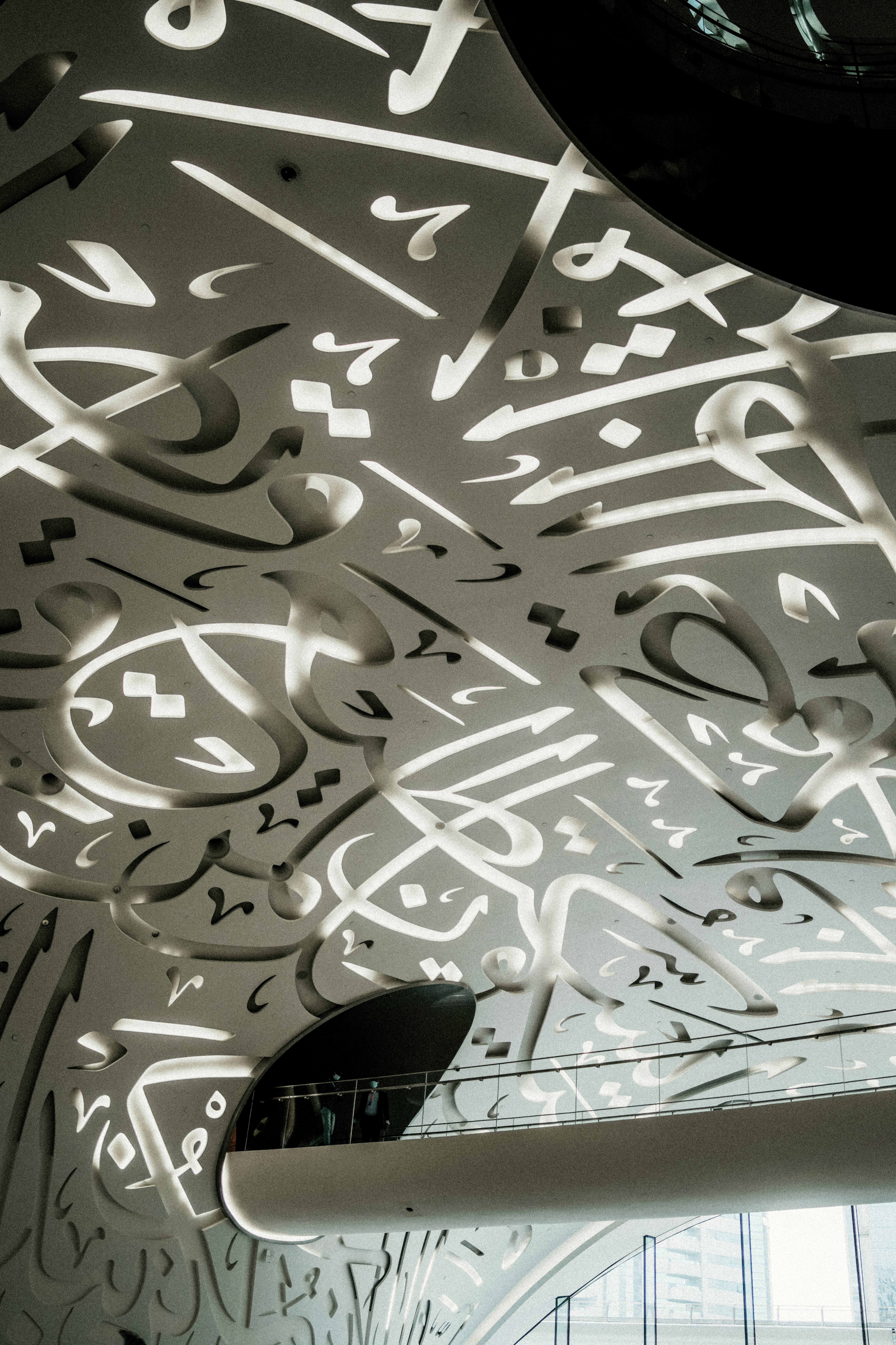 A clock mounted to the ceiling of a building photo – Free Grey Image on ...