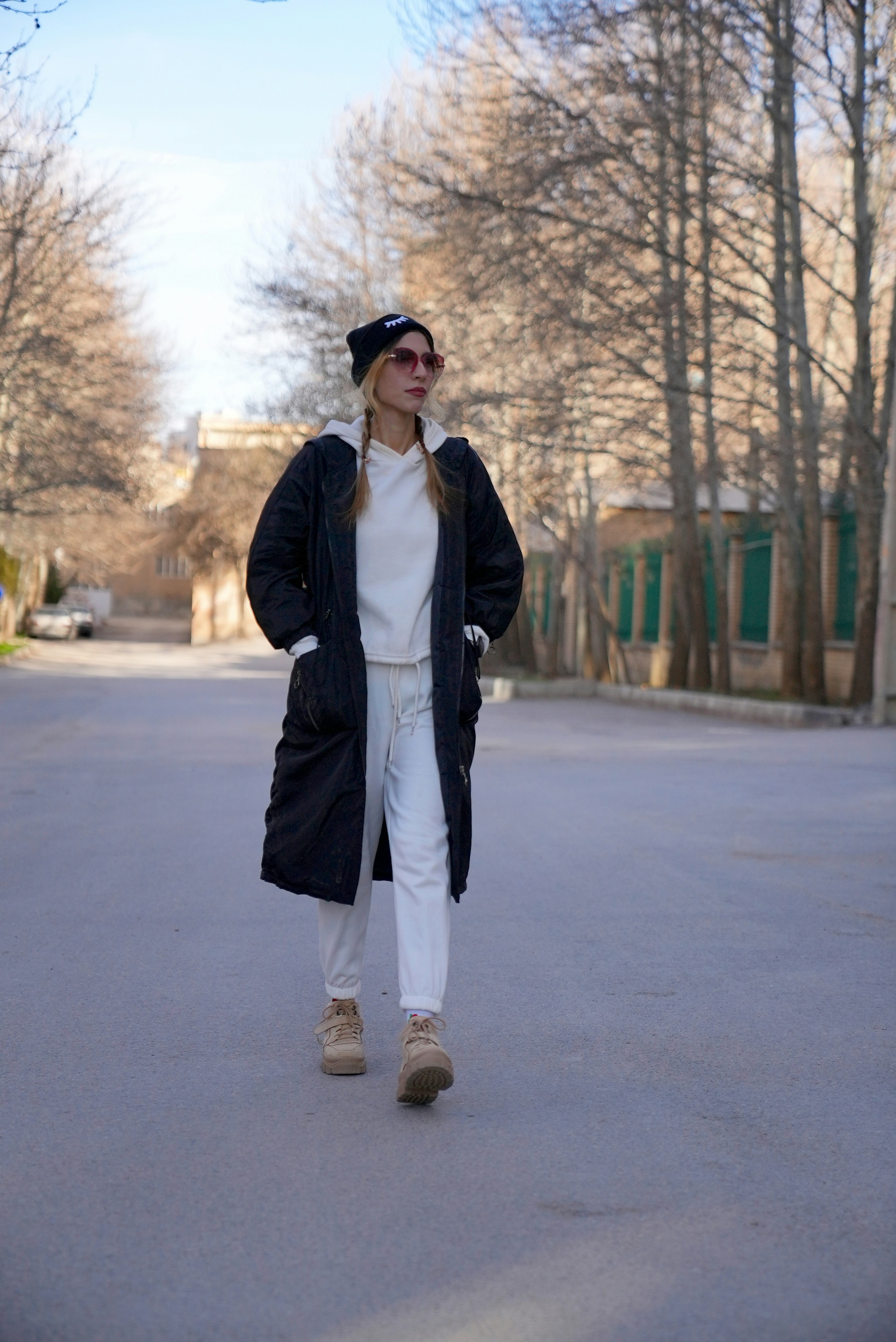 Handsome girl posing in street style 