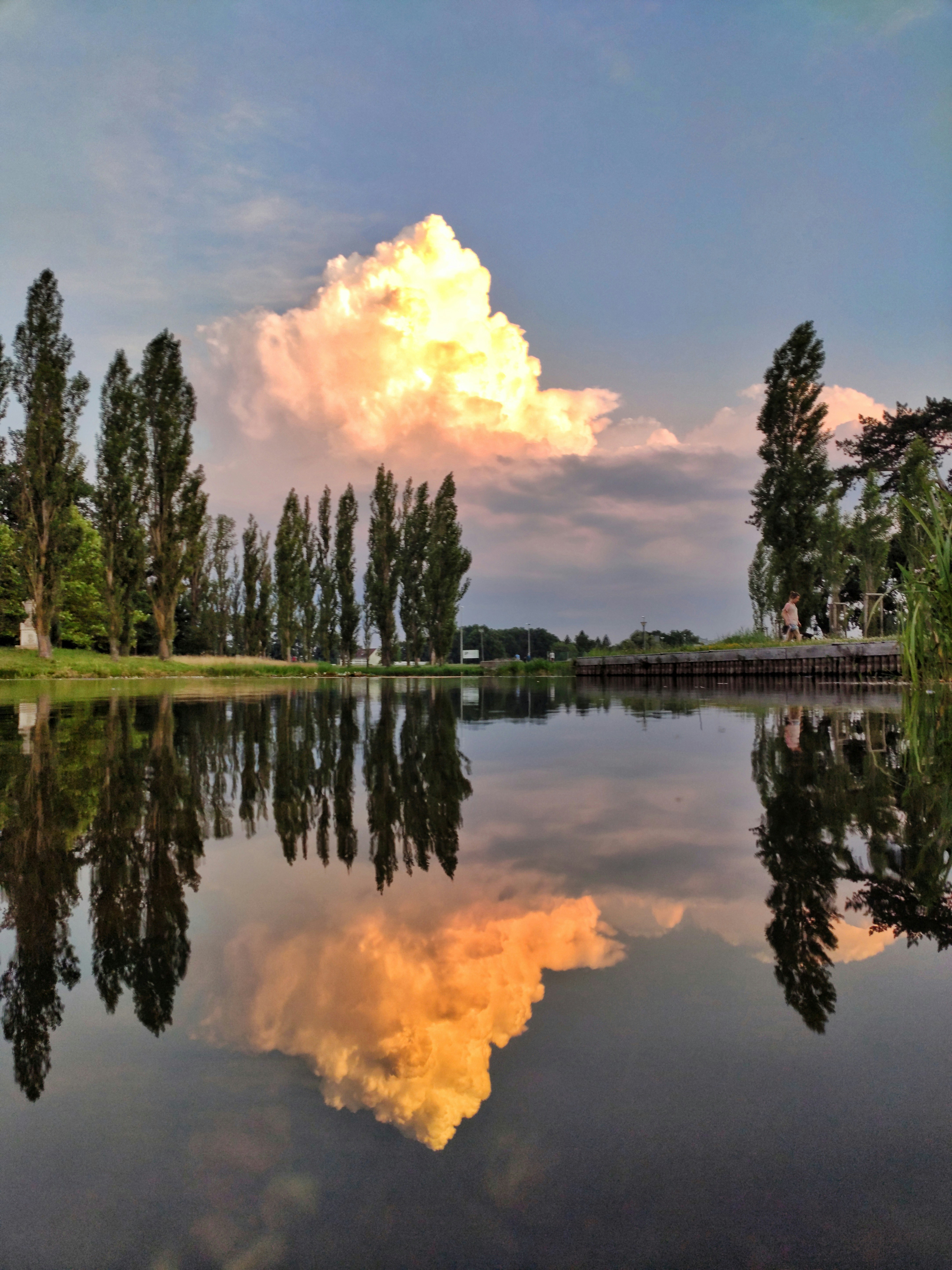Cloudfire Over a Tranquil Park Lake: Mirror of Sky and Trees