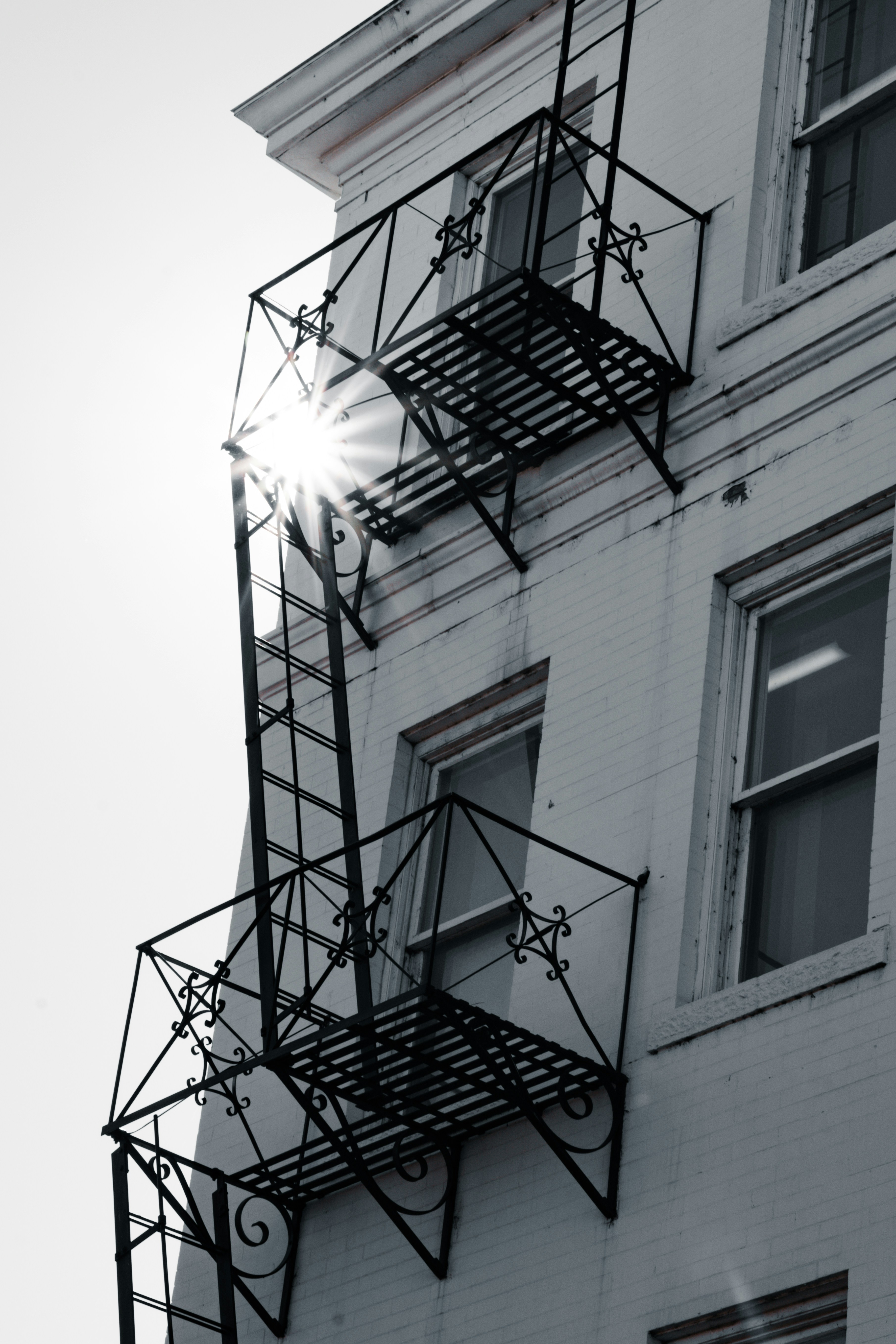 A fire escape on the side of a building photo – Free Building Image on ...