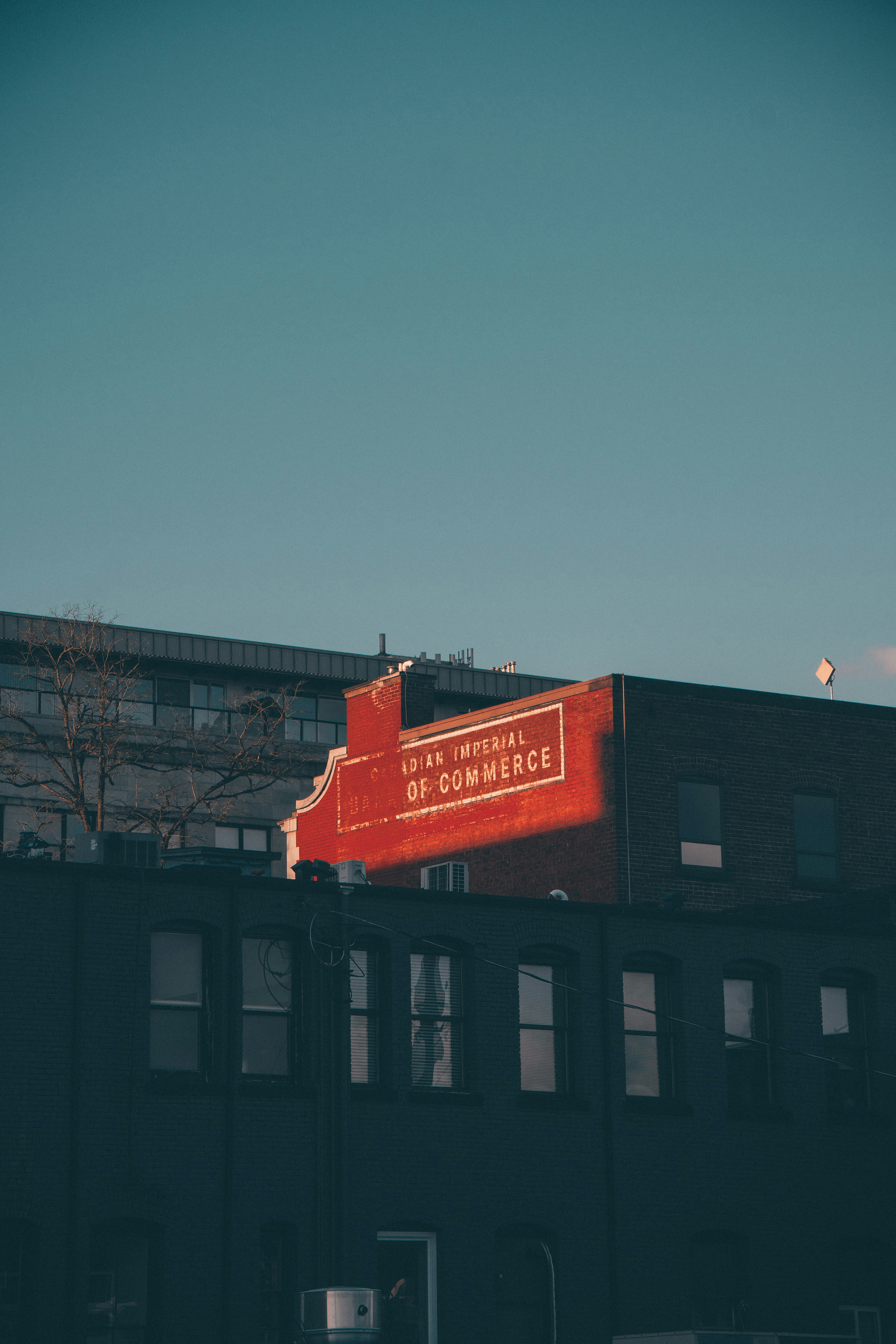 A large red sign on the side of a building photo – Free Tamron 1770 ...