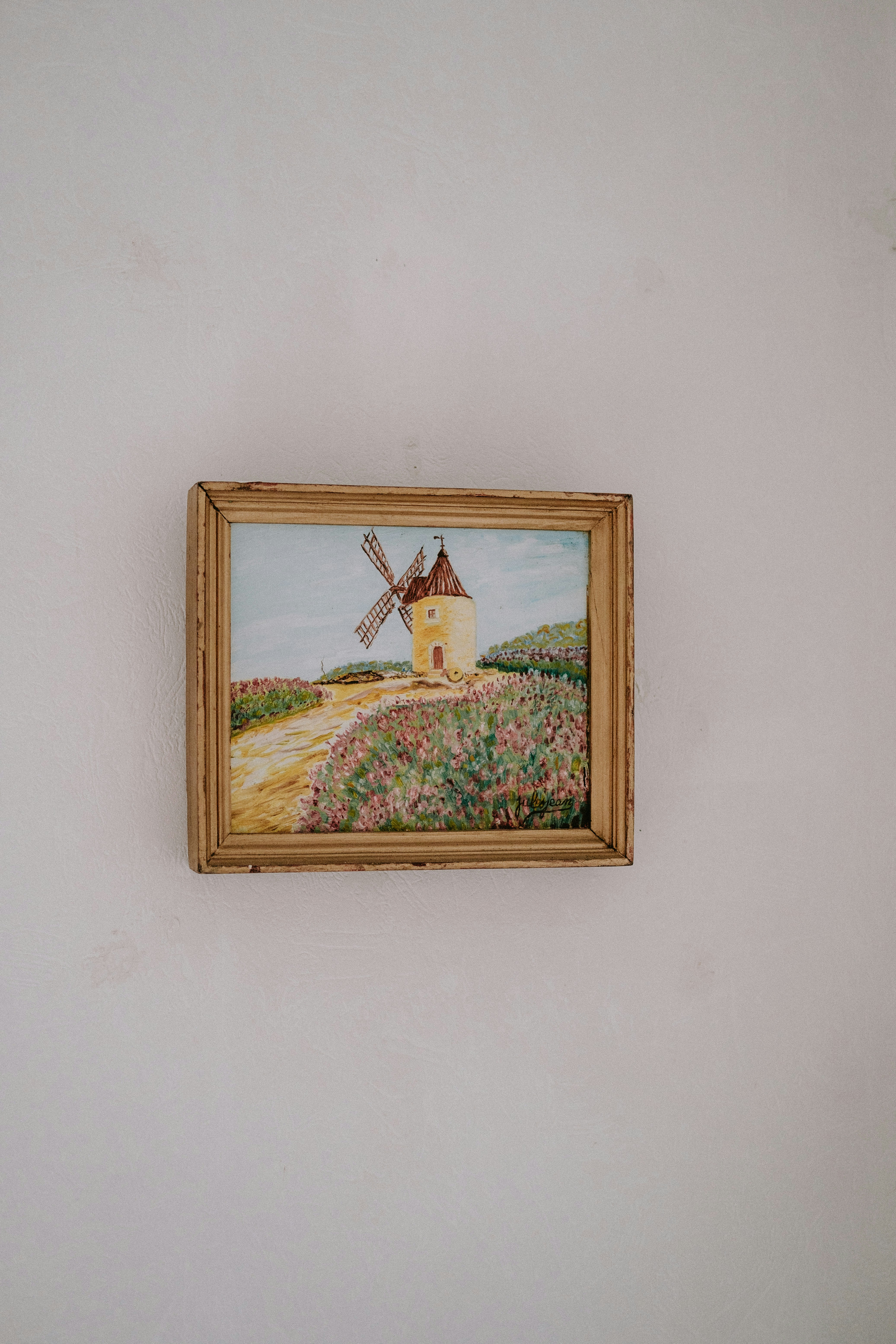 Windmill on a Painted Path: A Rustic Frame in Soft Light