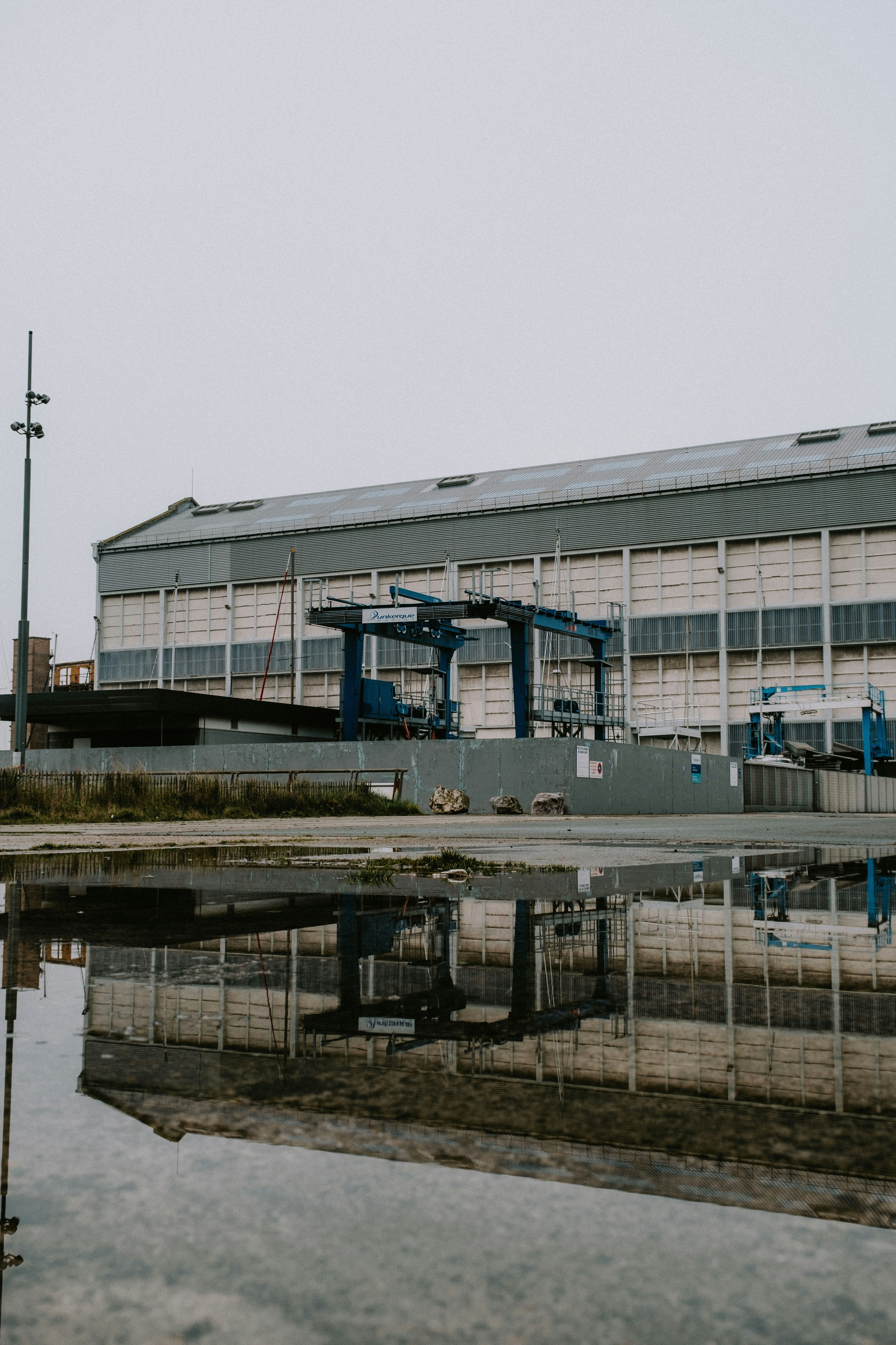 a large building with a crane in front of it