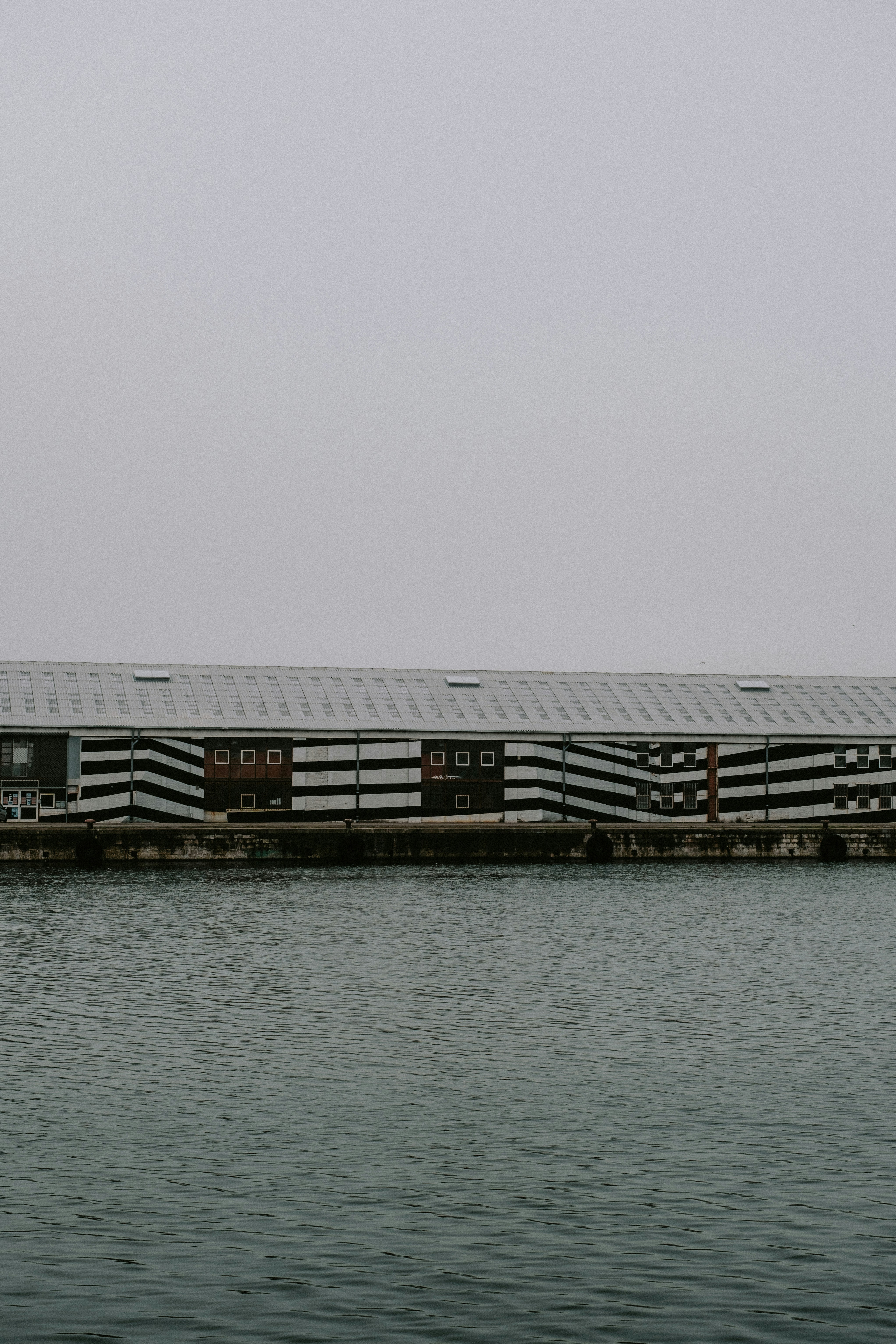 a large building sitting on top of a body of water