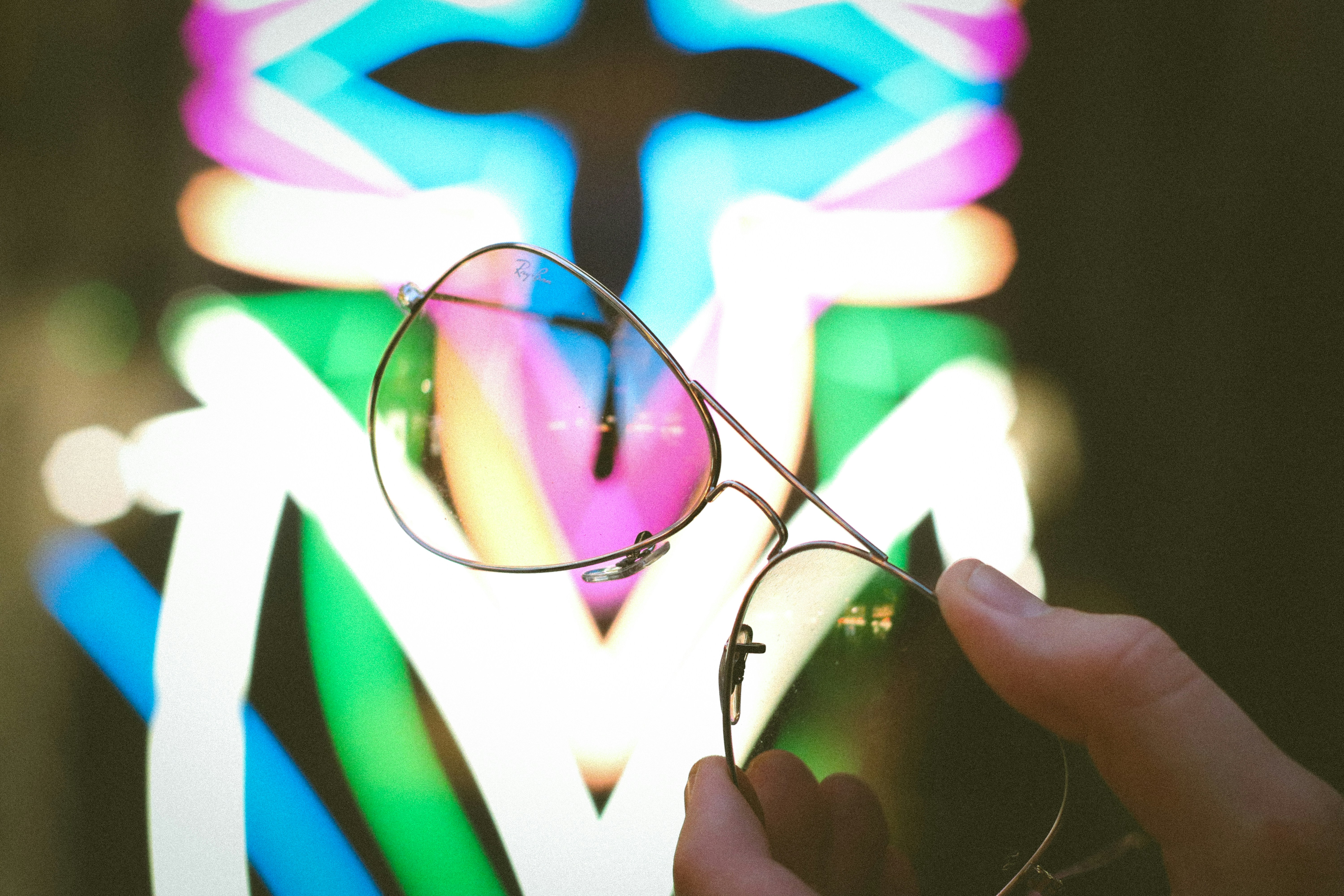 Glasses Framing Neon Echoes