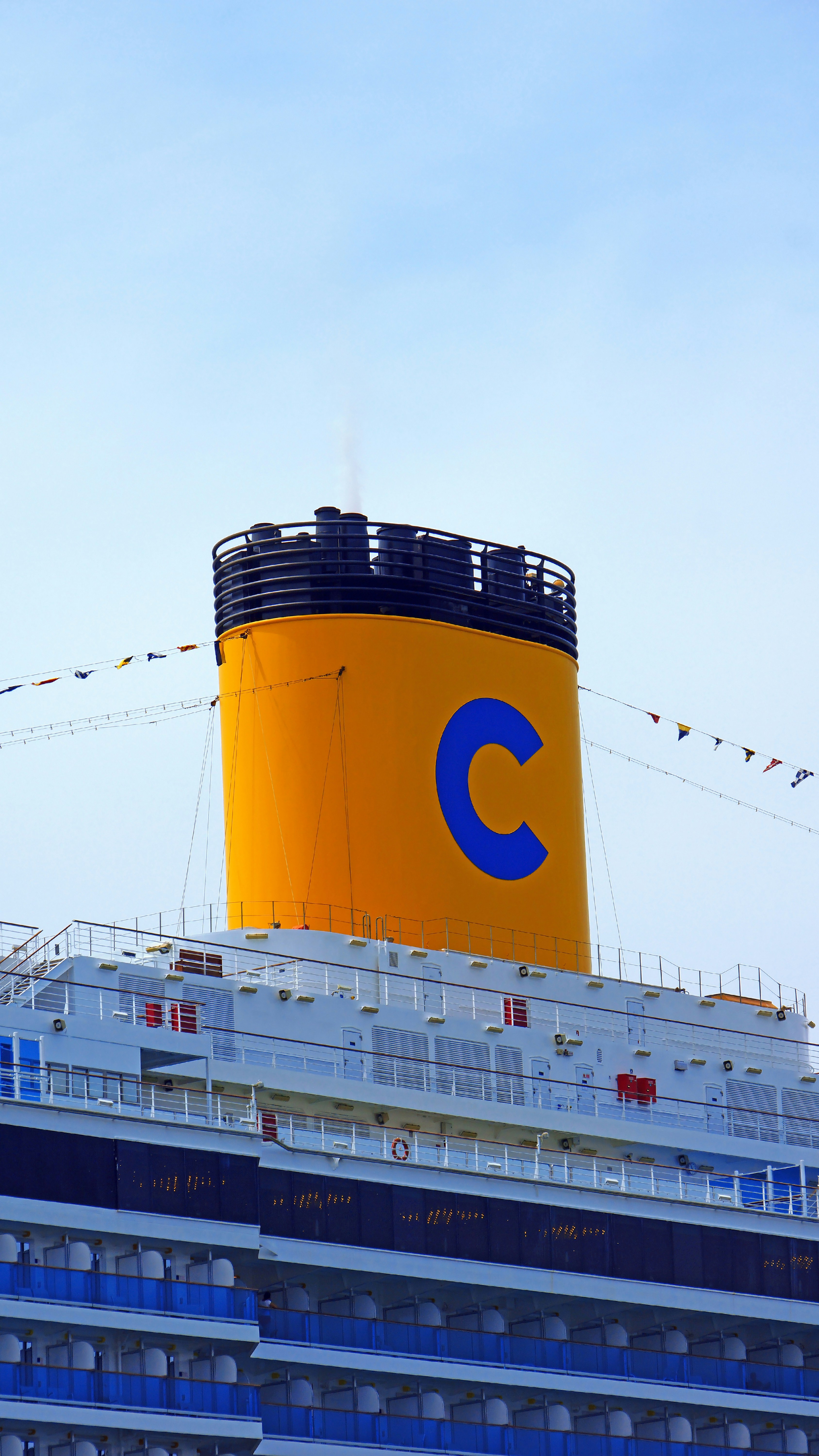 A large cruise ship with a large yellow water tank on top of it photo ...