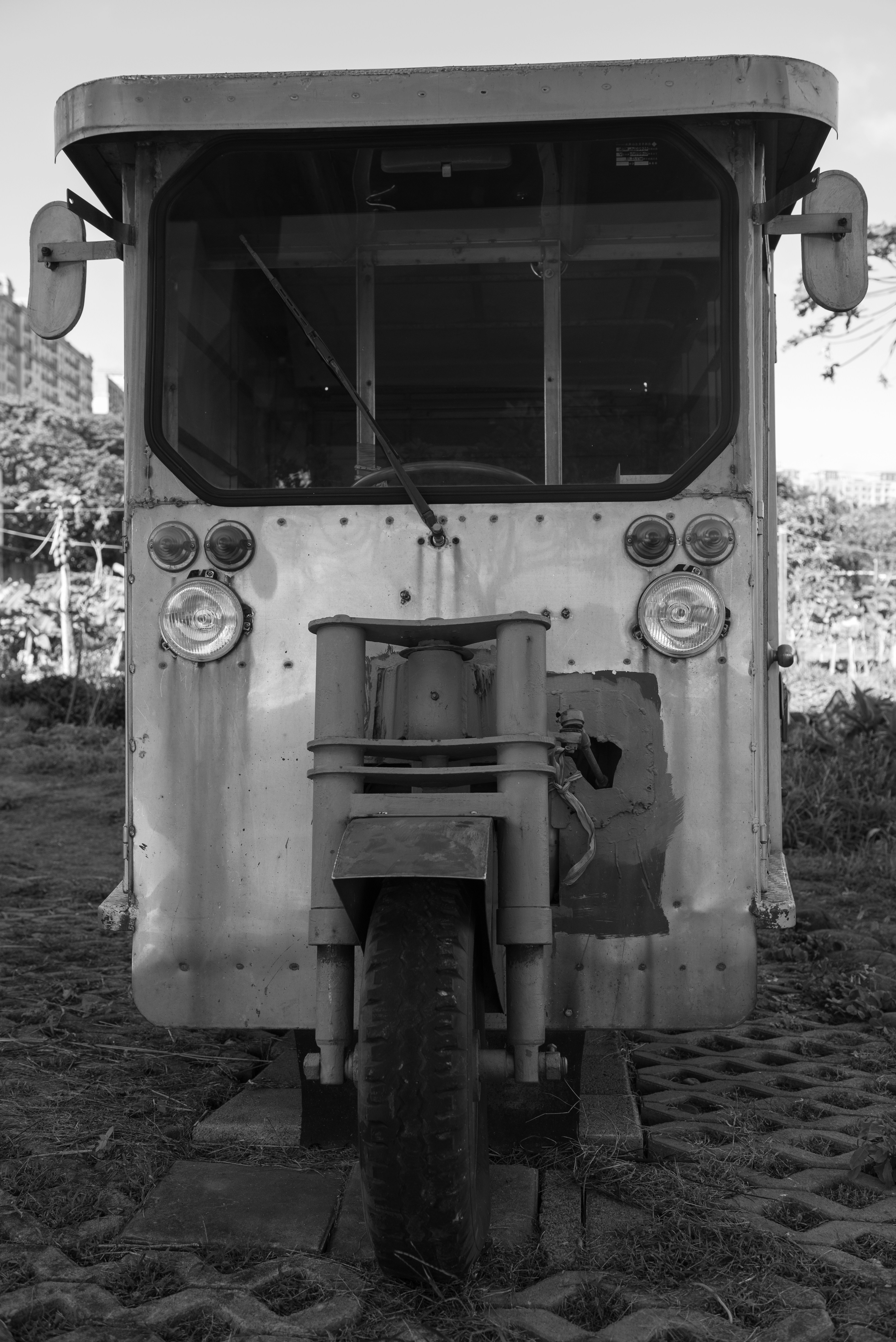 a black and white photo of an old bus