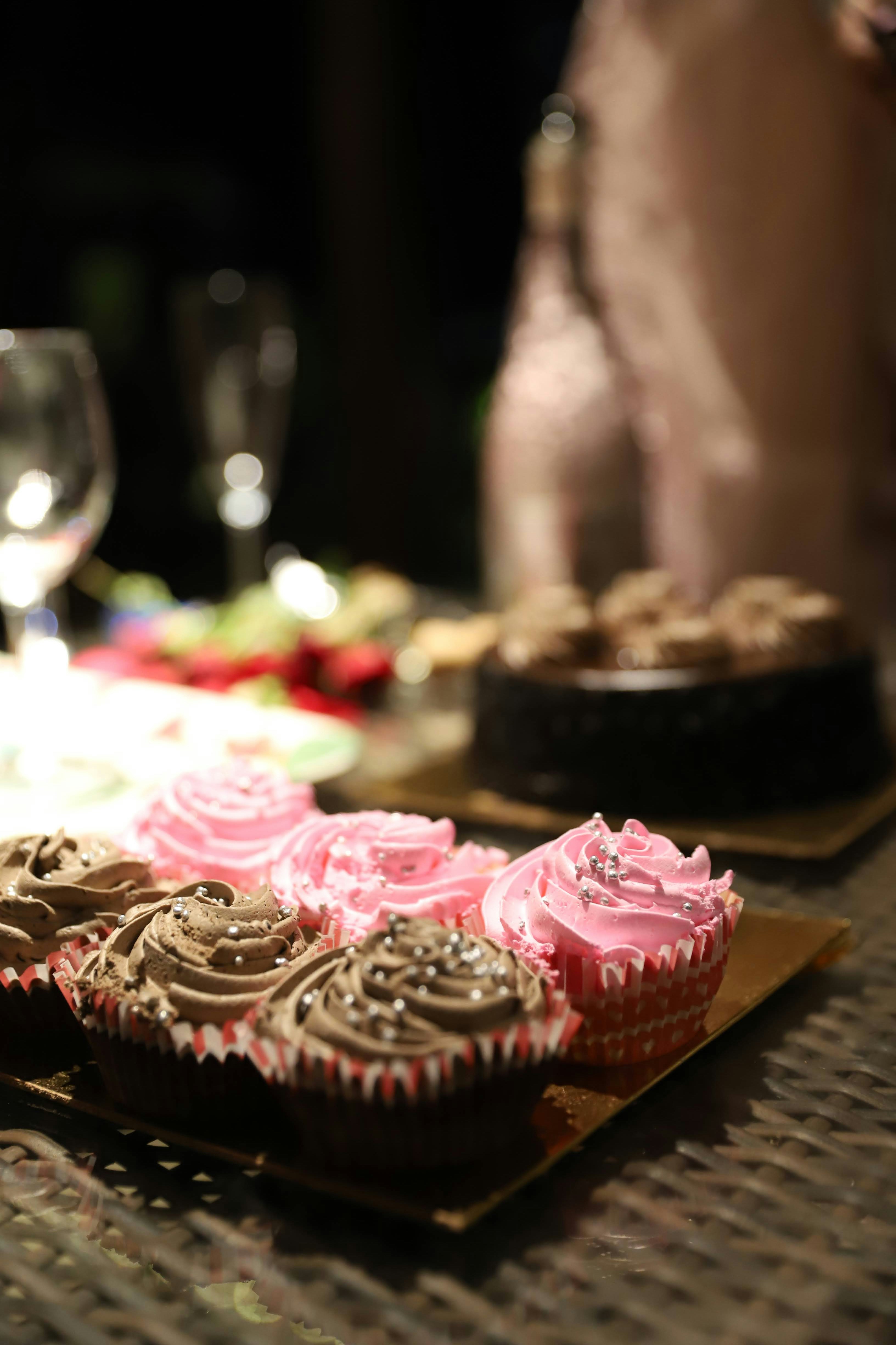 Pink Cupcakes Under Soft Spotlight on a Dessert Tray