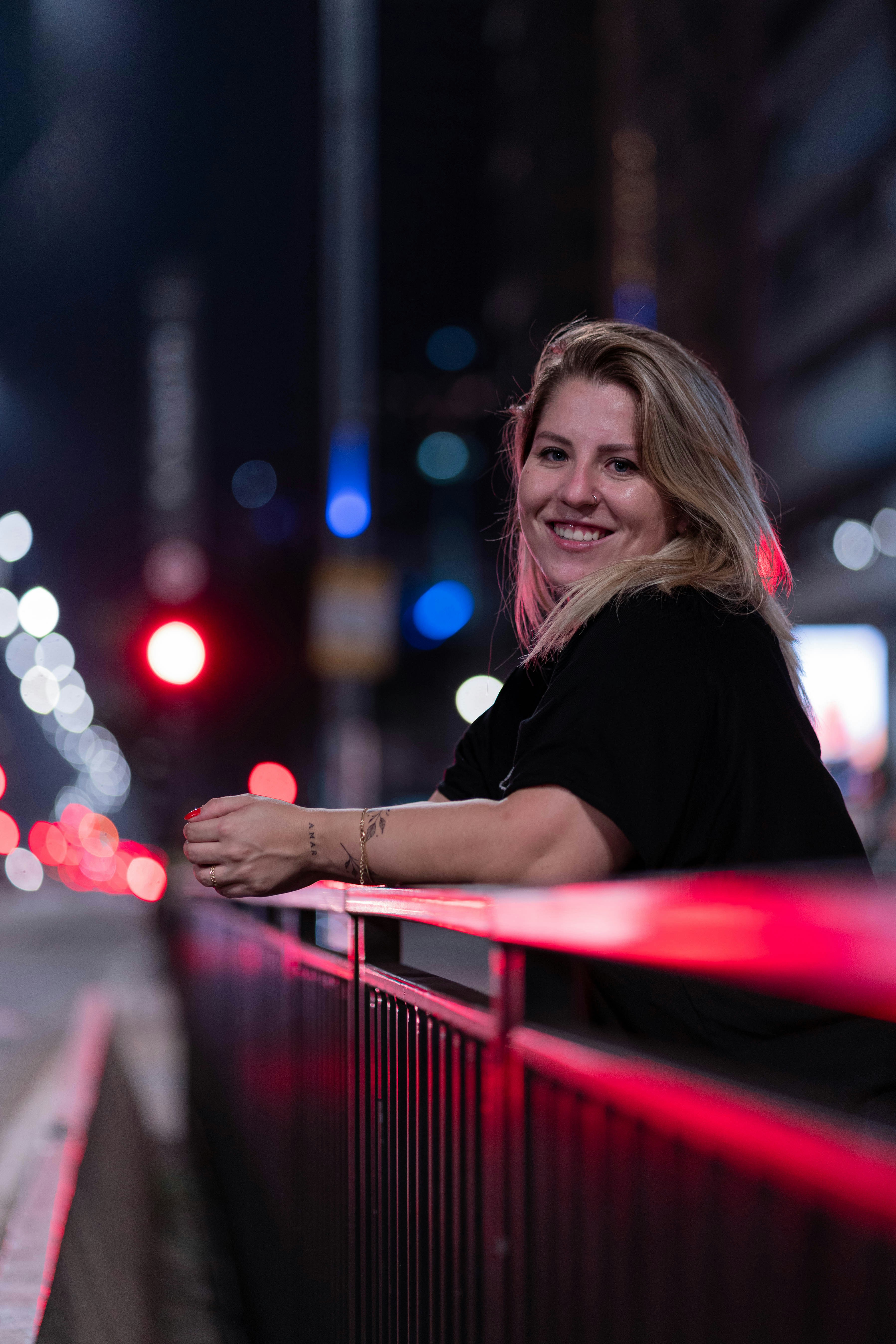 Nighttime Brilliance: A Confident Smile on the City Rail