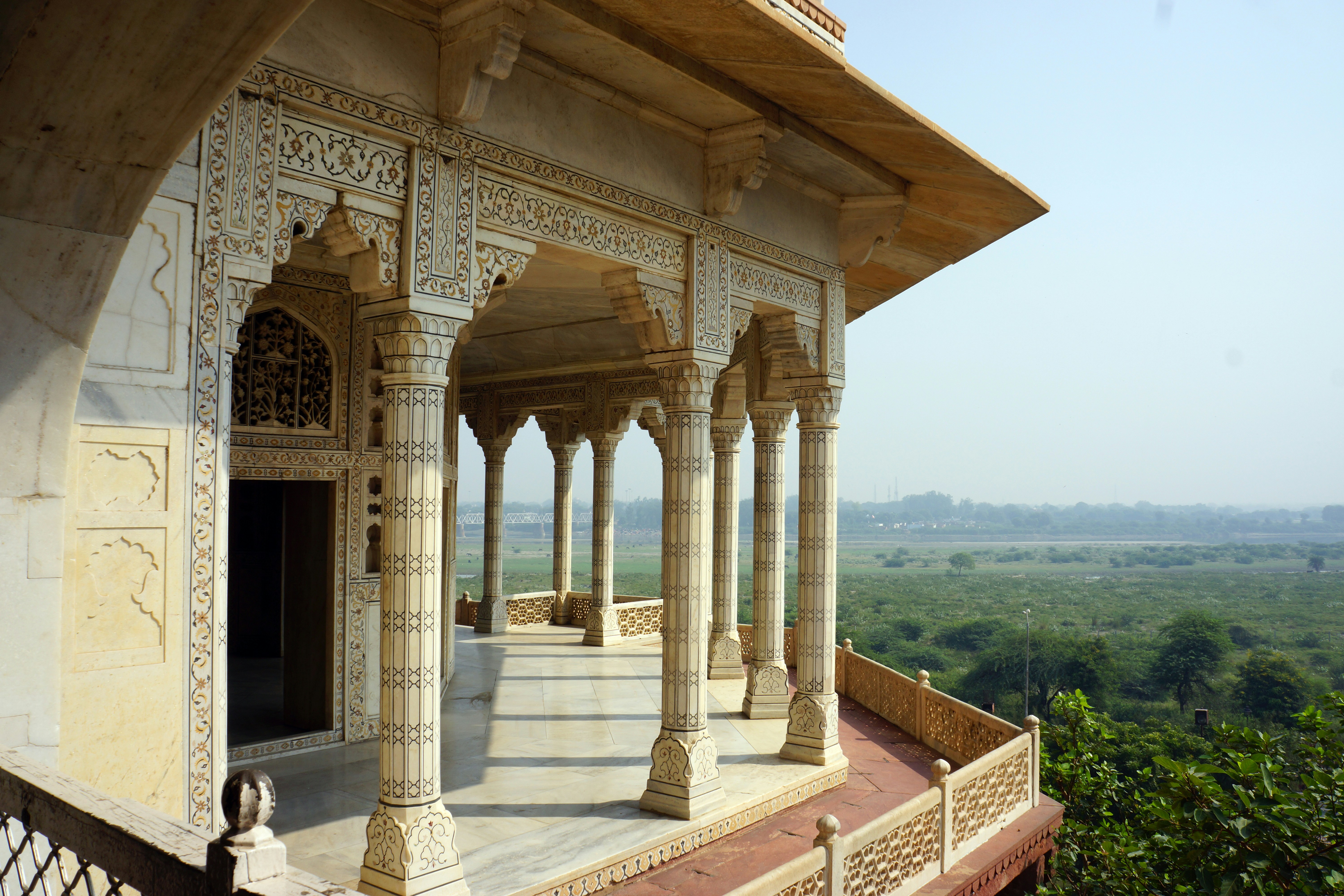 A large building with pillars and arches on top of it photo – Free Agra ...