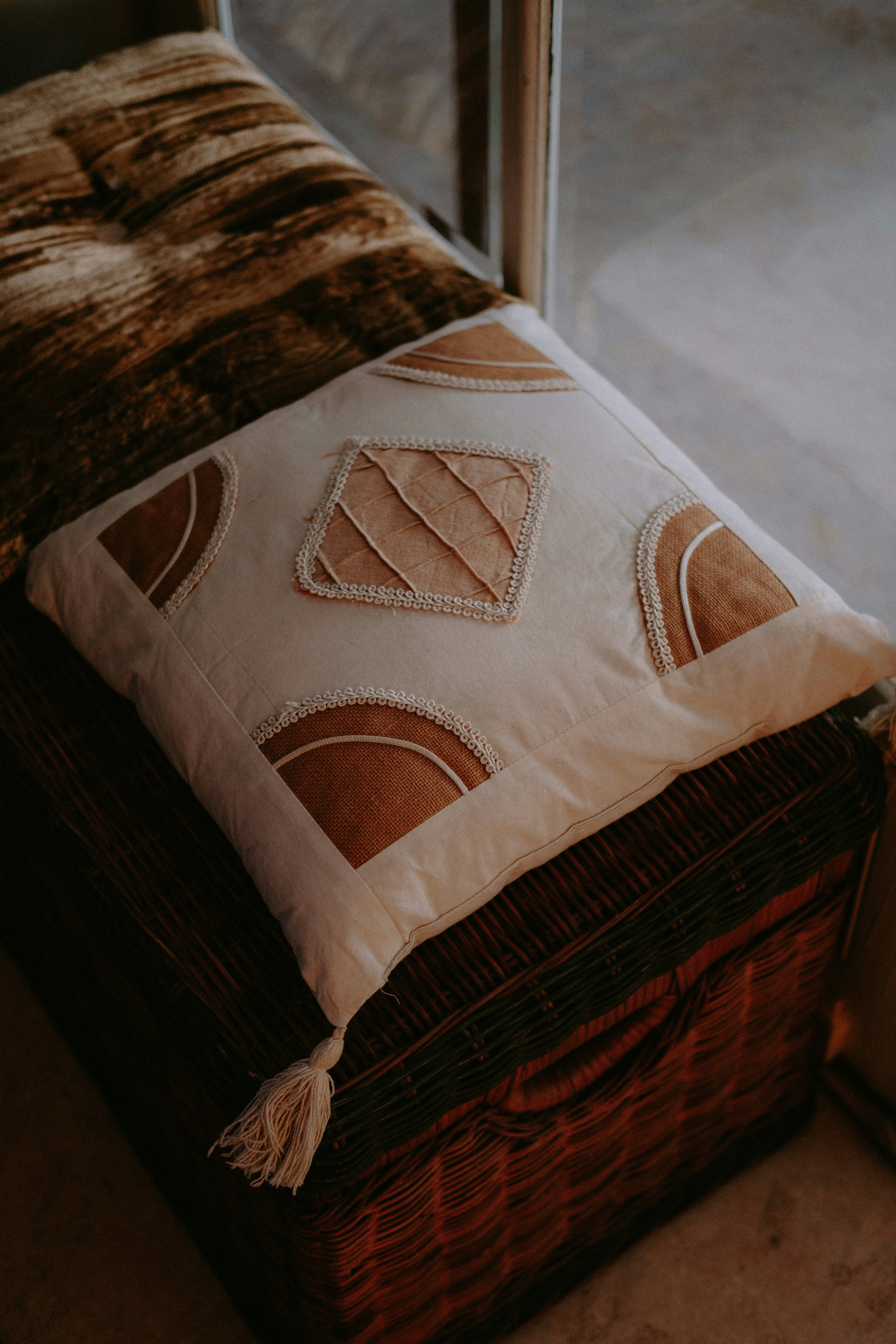 A brown and white cushion sitting on top of a bed photo – Free Grey ...