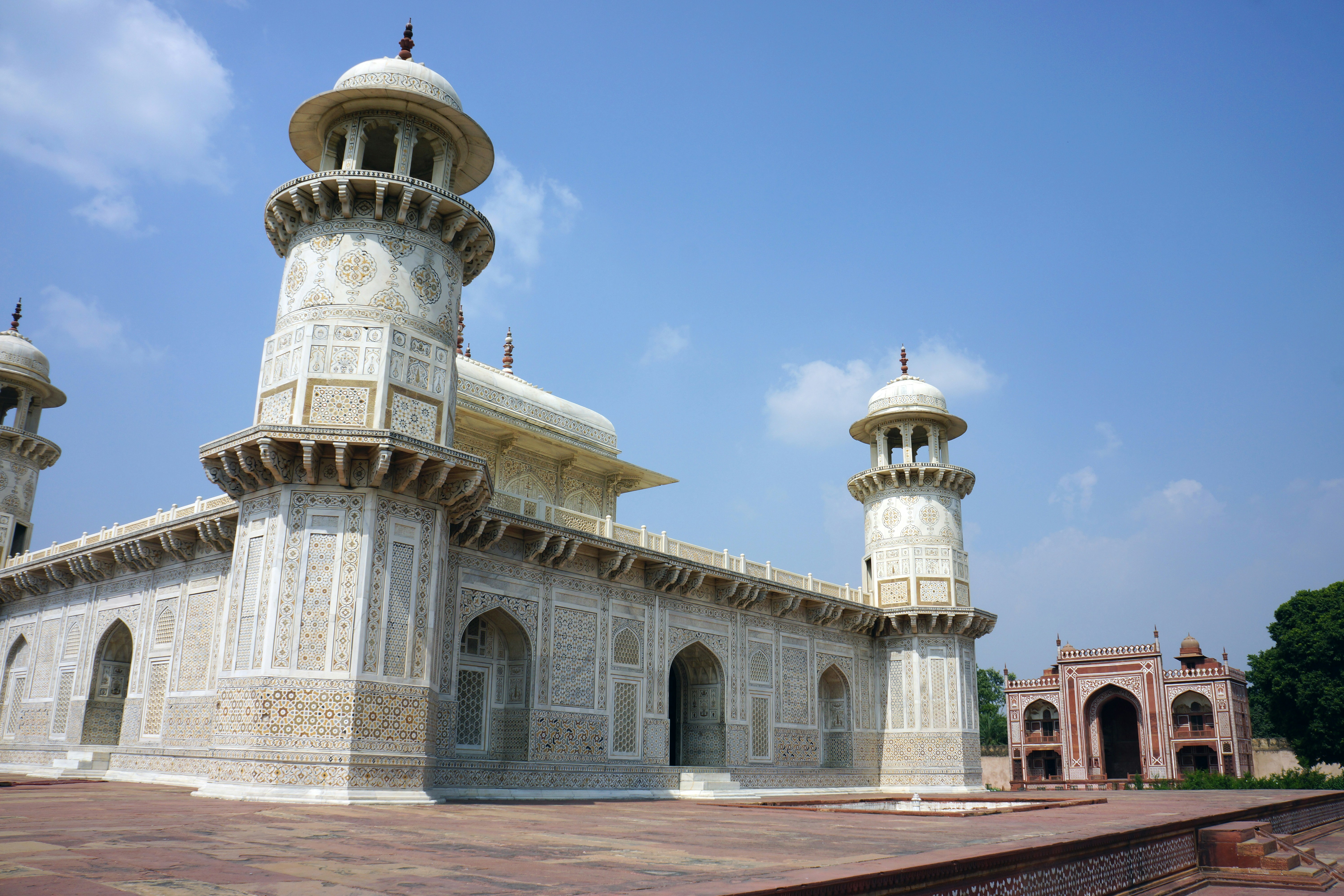 a large white building with two towers on top of it