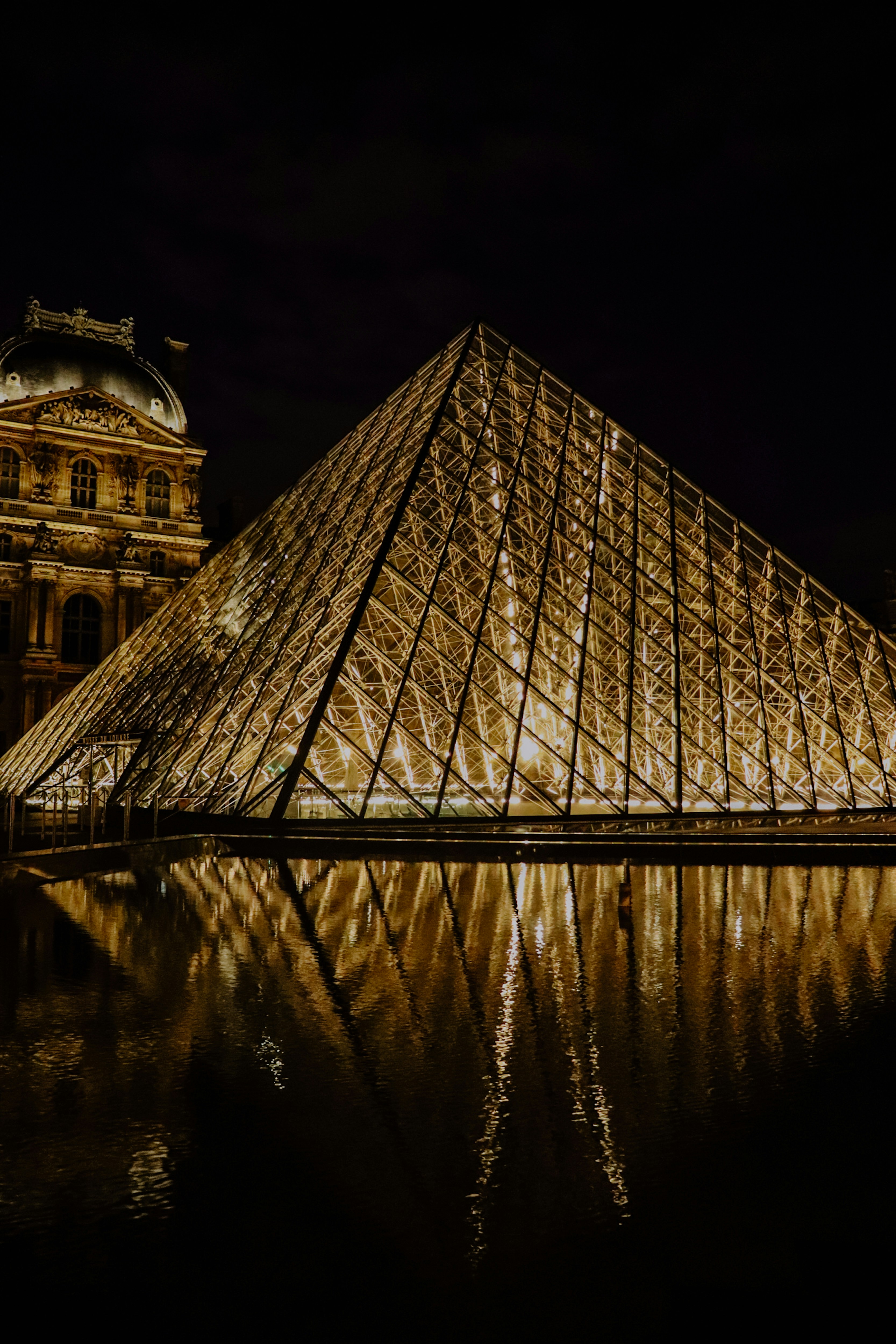 A large glass pyramid in front of a building photo – Free France Image ...