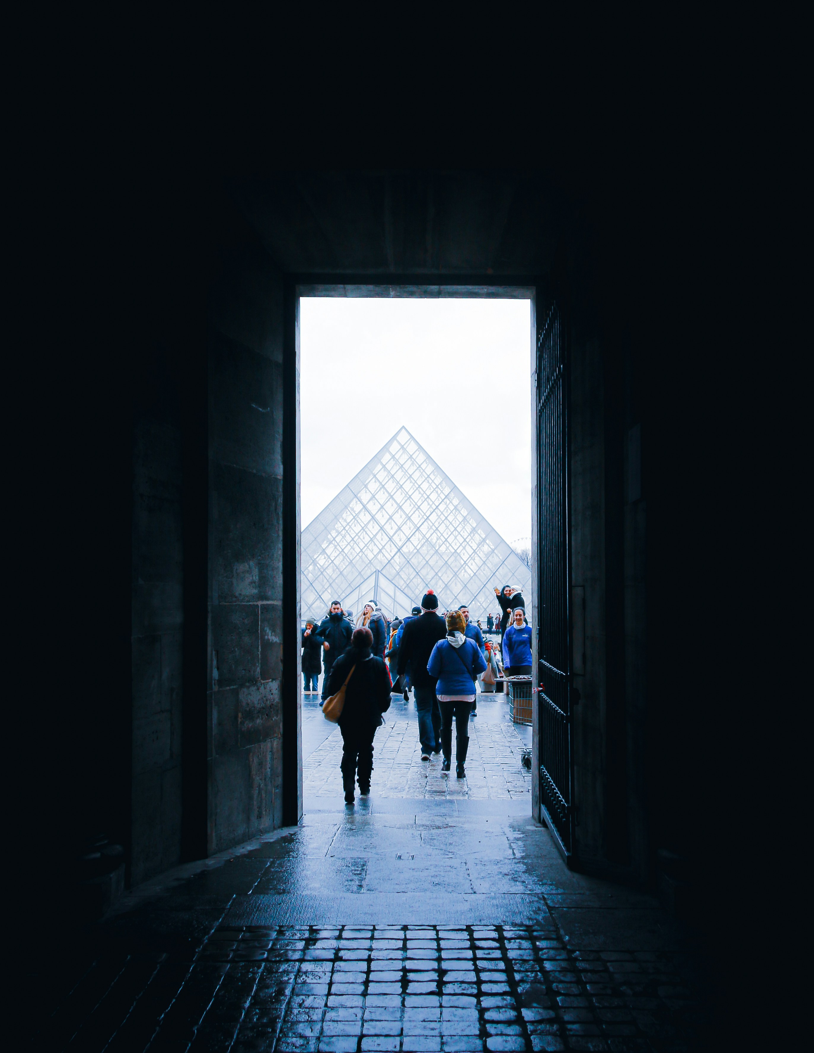 A group of people walking into a building photo – Free France Image on ...