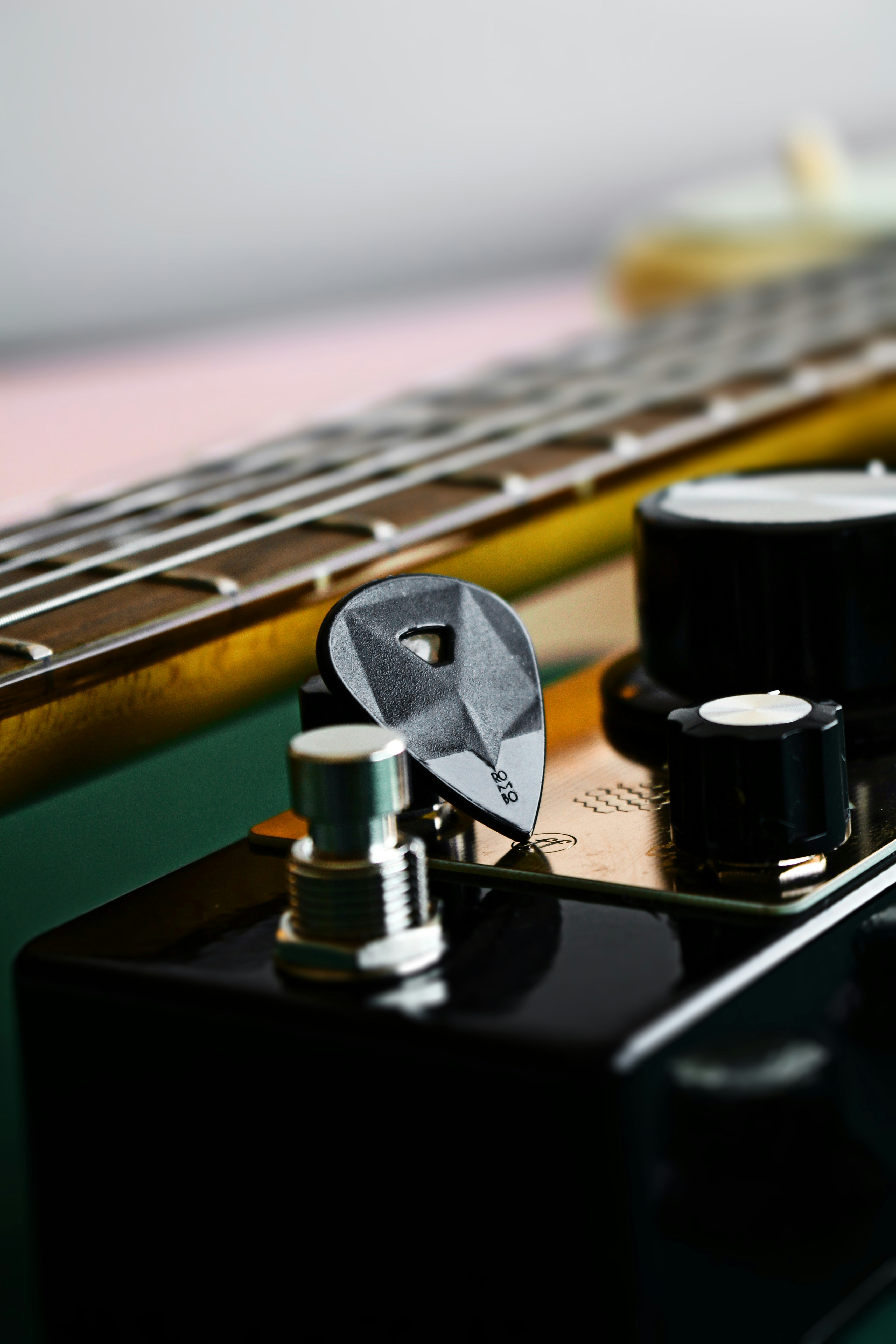 A close up of a guitar's neck and knobs photo – Free Guitar Image on ...