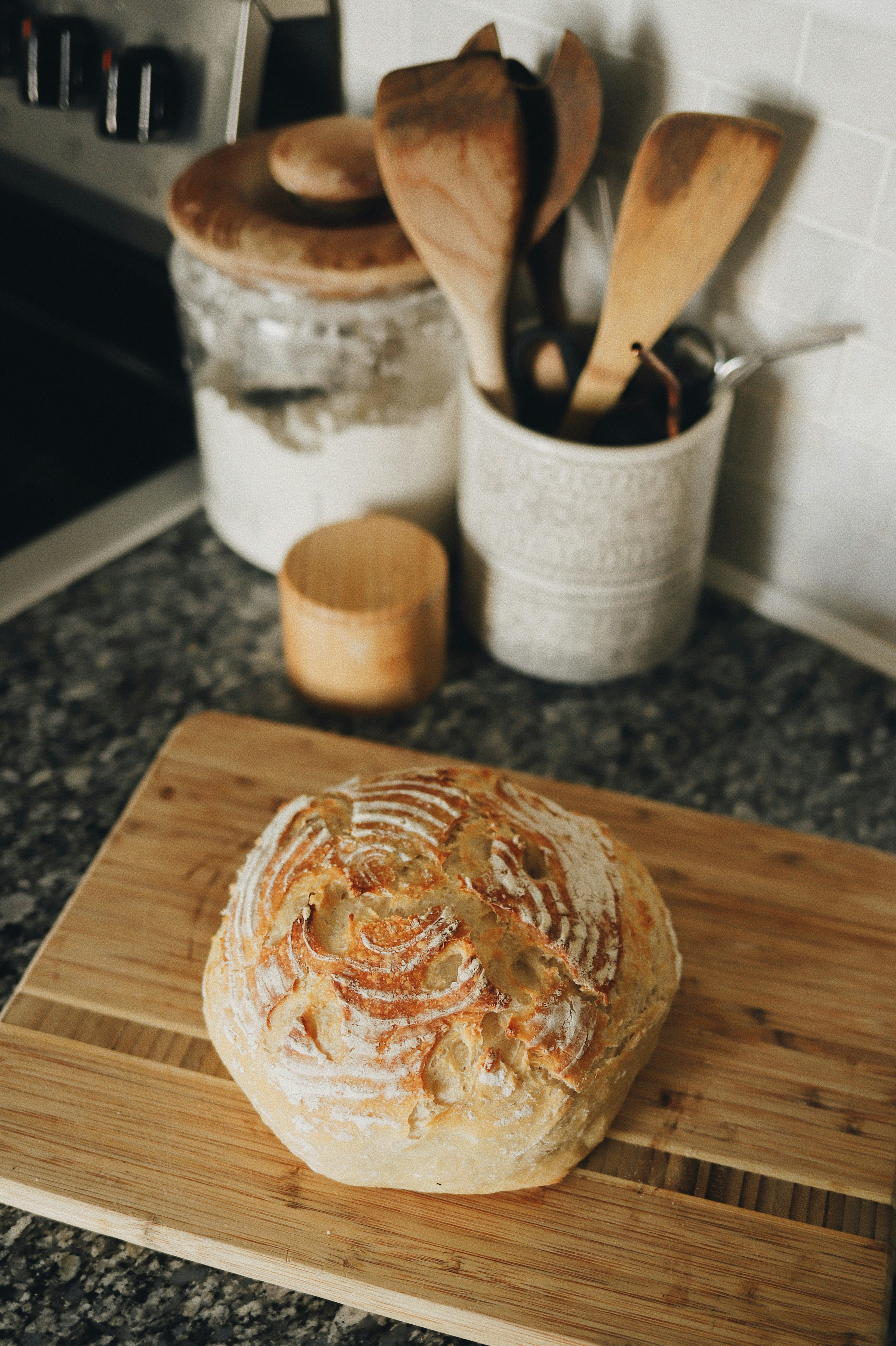 Rustic loaf on a wooden board: a studio kitchen portrait