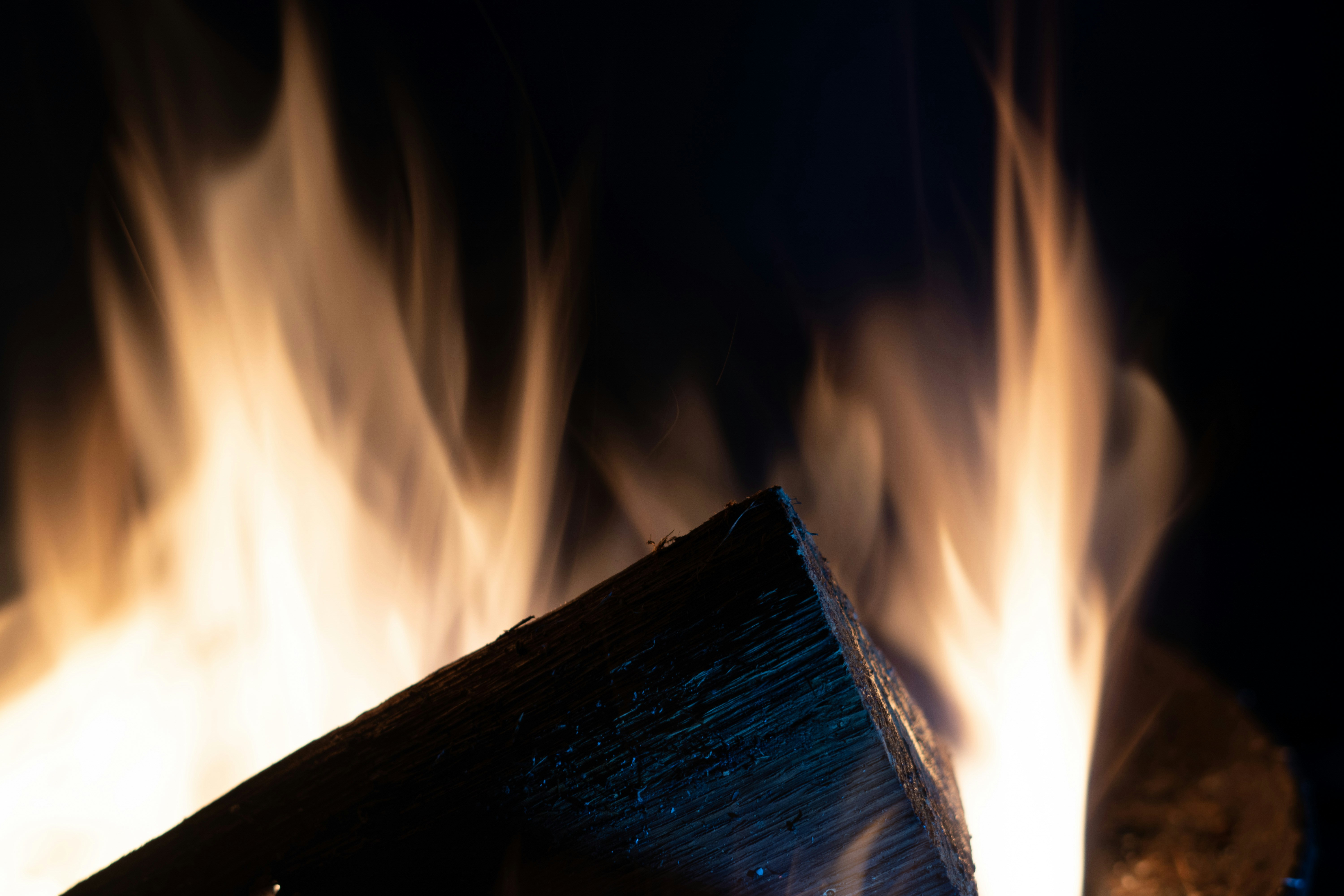 A fire burning in a fireplace with bright flames photo – Free Fire ...