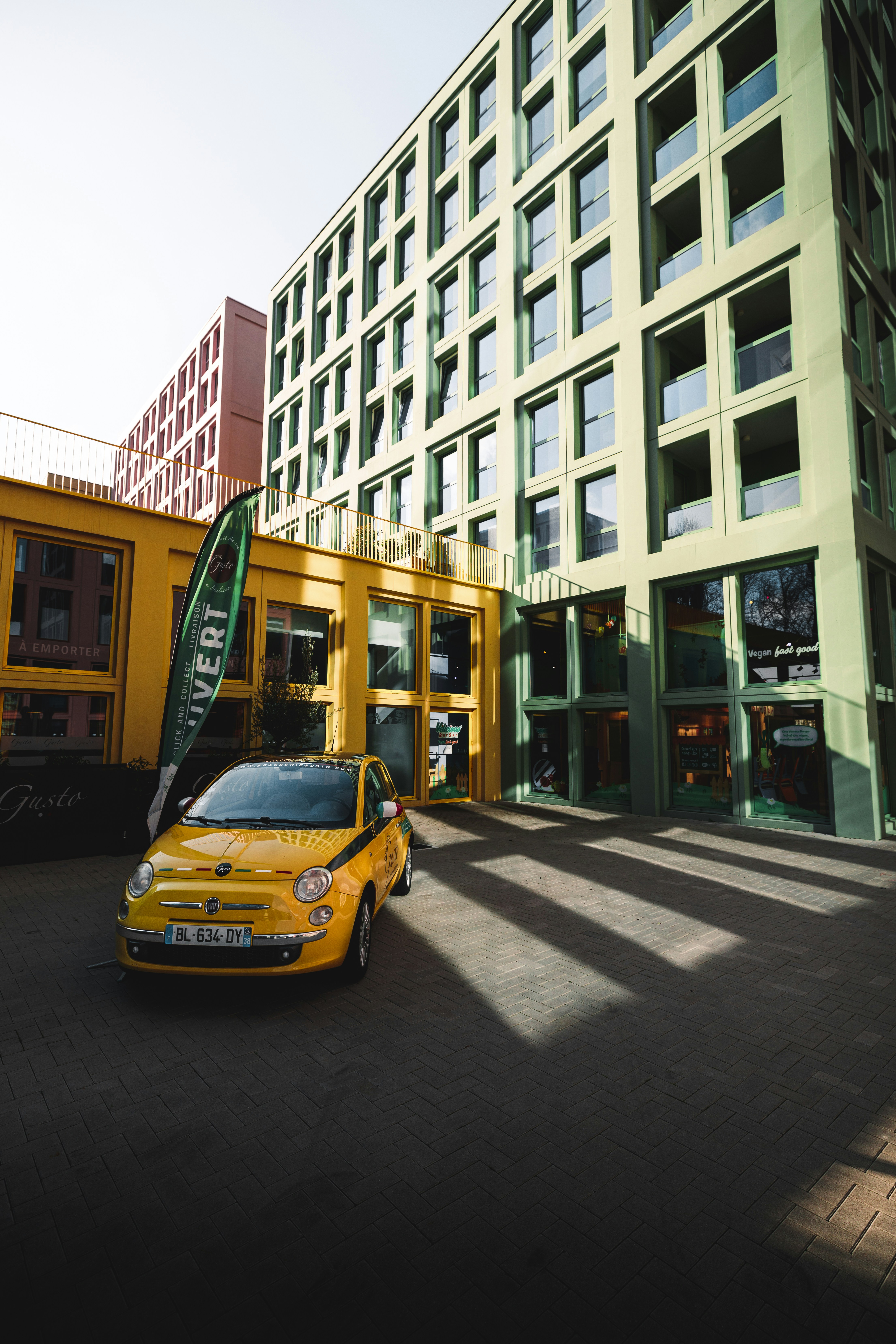 Yellow Taxi in a Prism of Modern Architecture