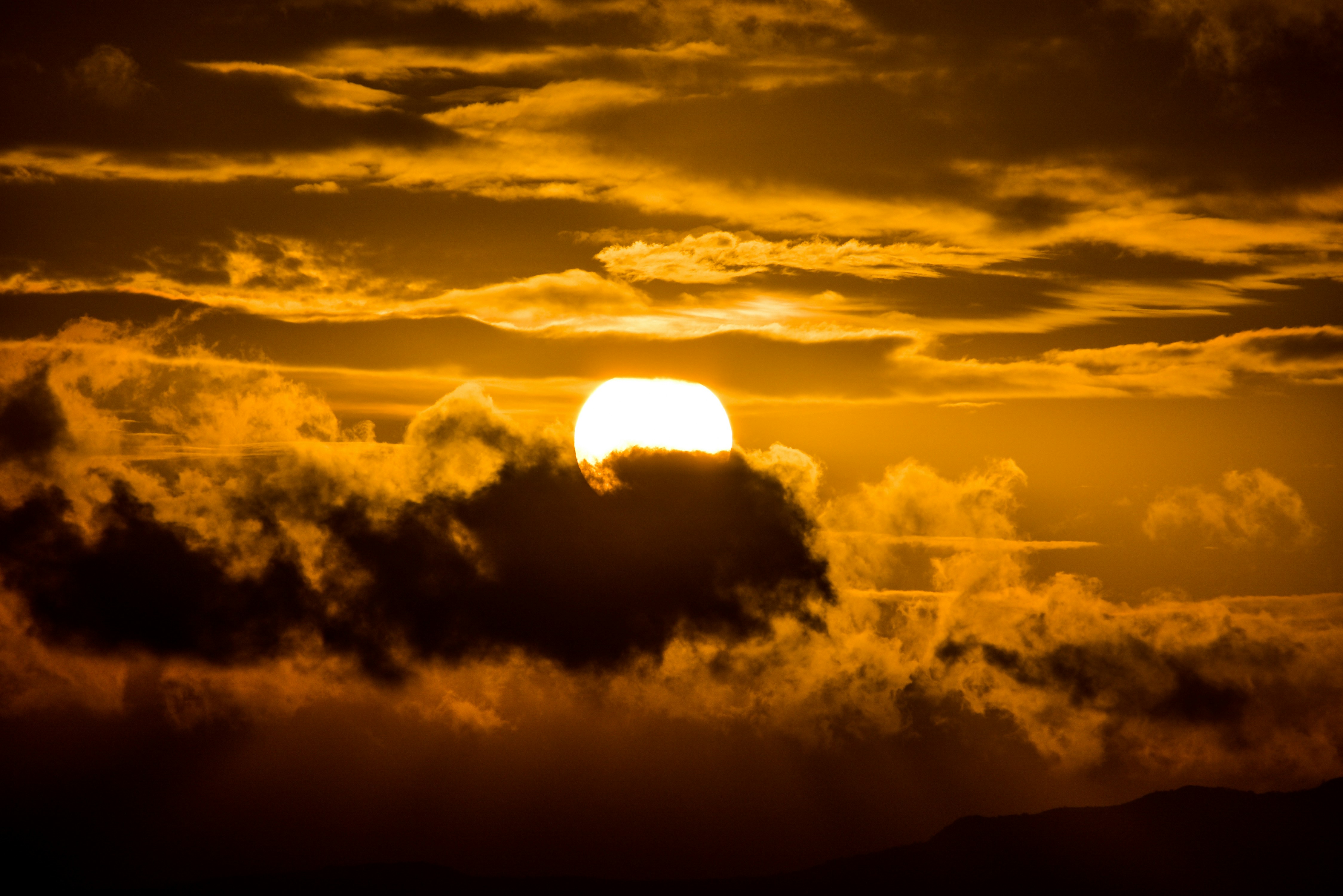 The sun is setting over the clouds in the sky photo – Free Nature Image ...