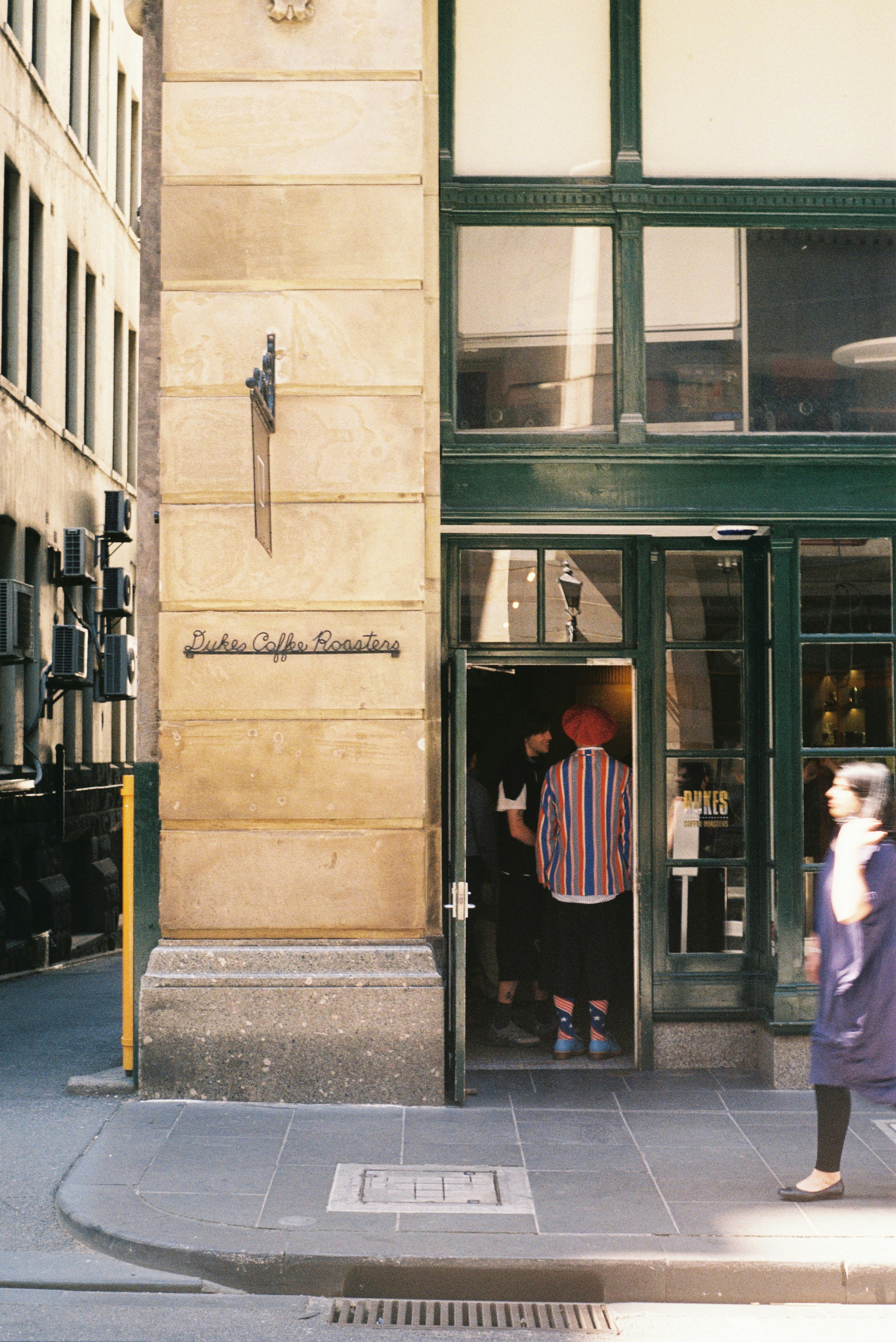 A group of people standing outside of a building photo – Free Australia ...