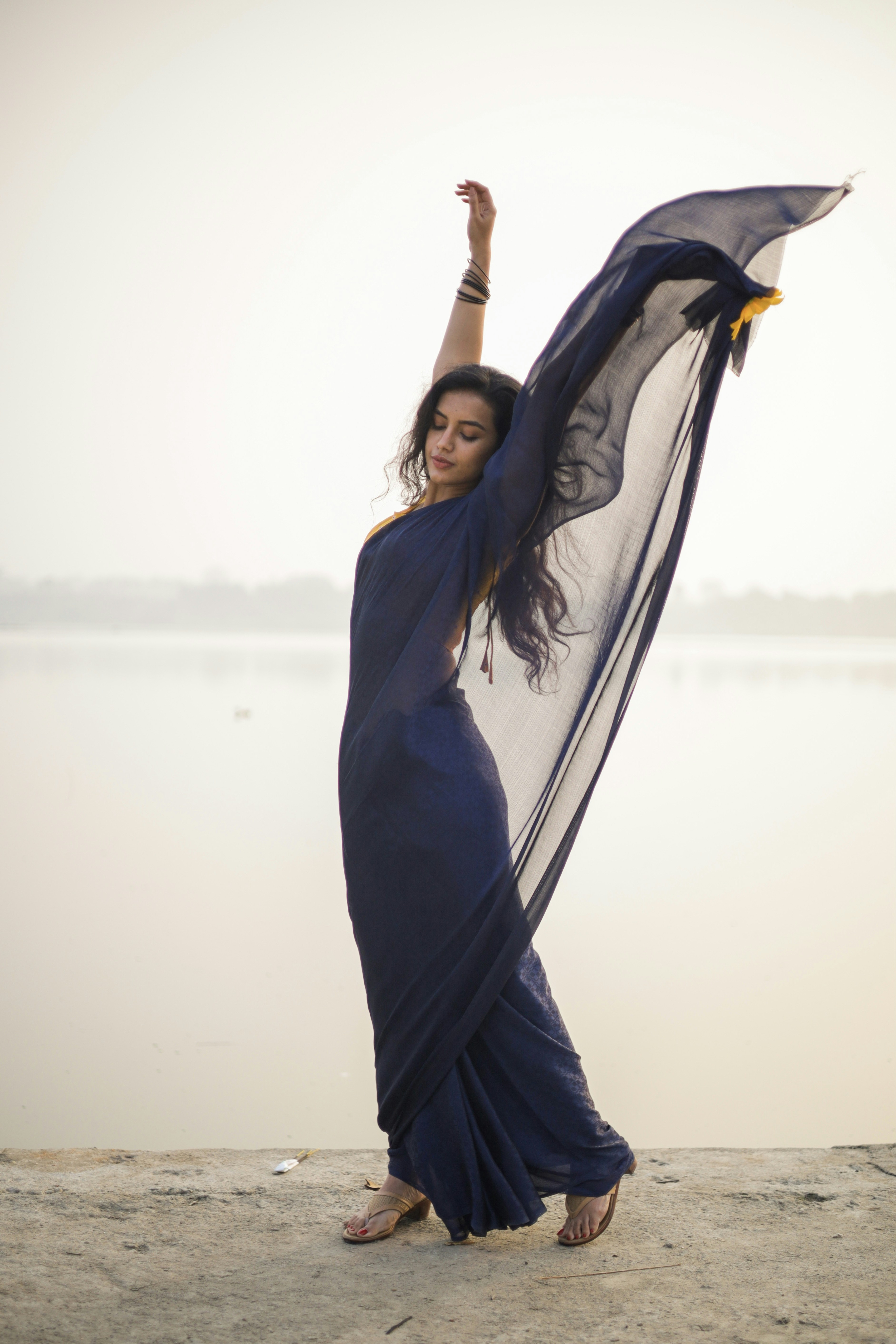 Grace in Motion: Veiled Silk by the Water