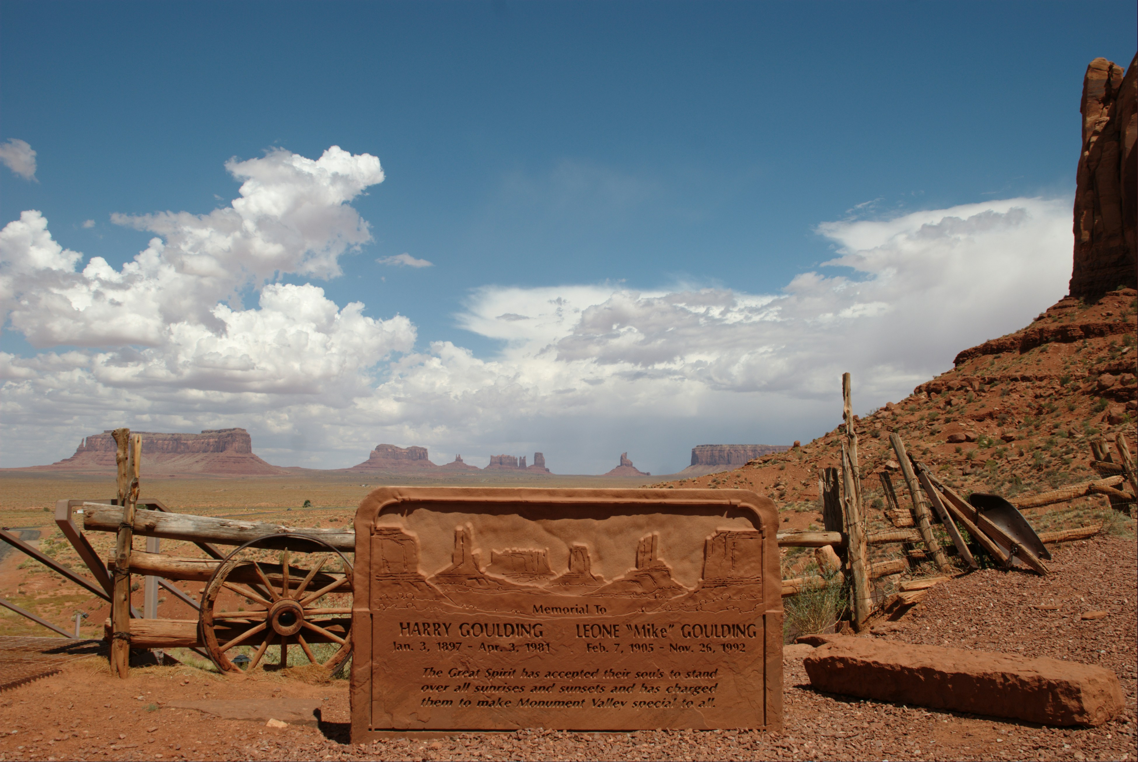 Memorial plaque honoring Harry Goulding and his wife, set against the backdrop of Monument Valley's iconic buttes.