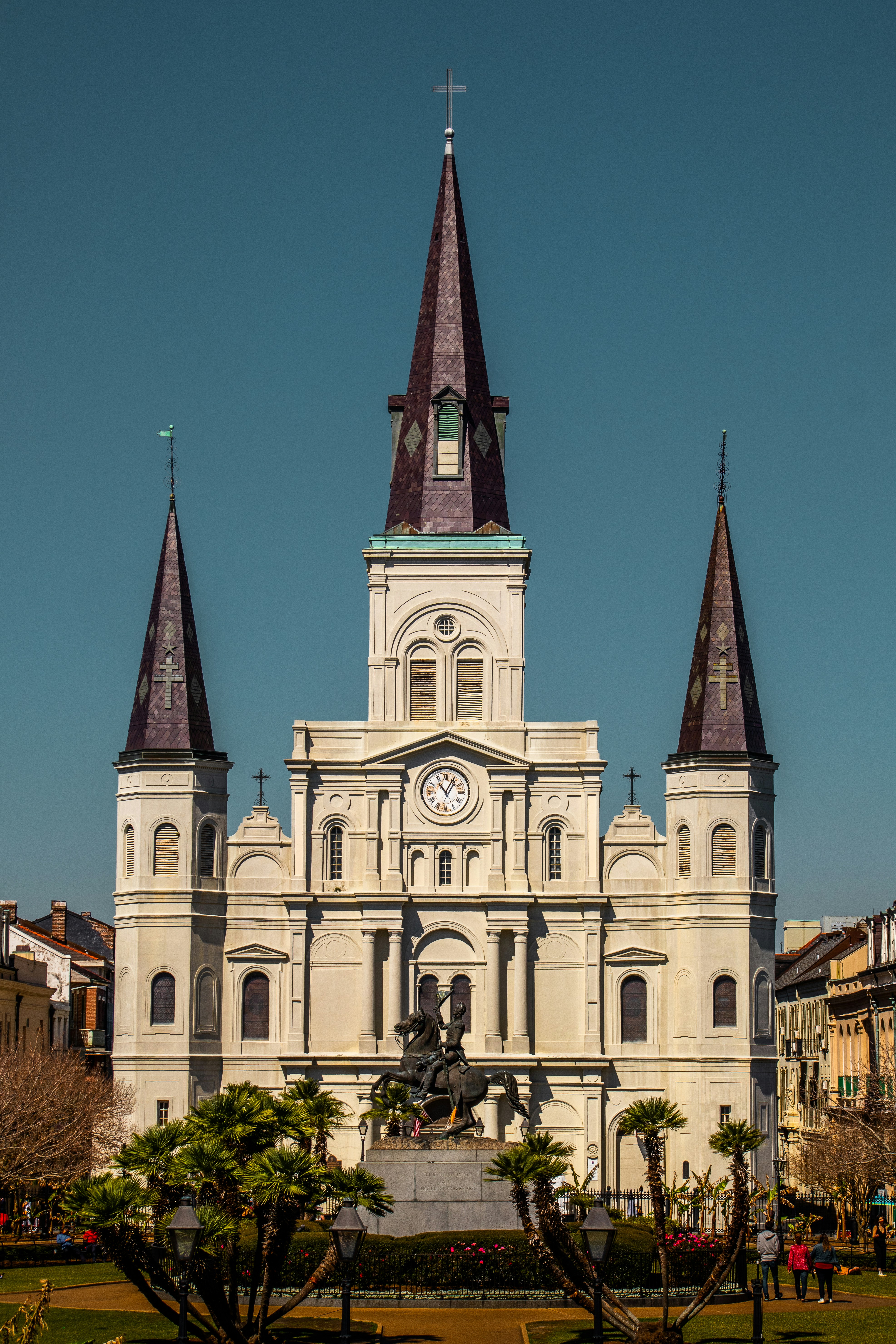 Three-Spired Cathedral Framed by a Bronze Rider in Jackson Square