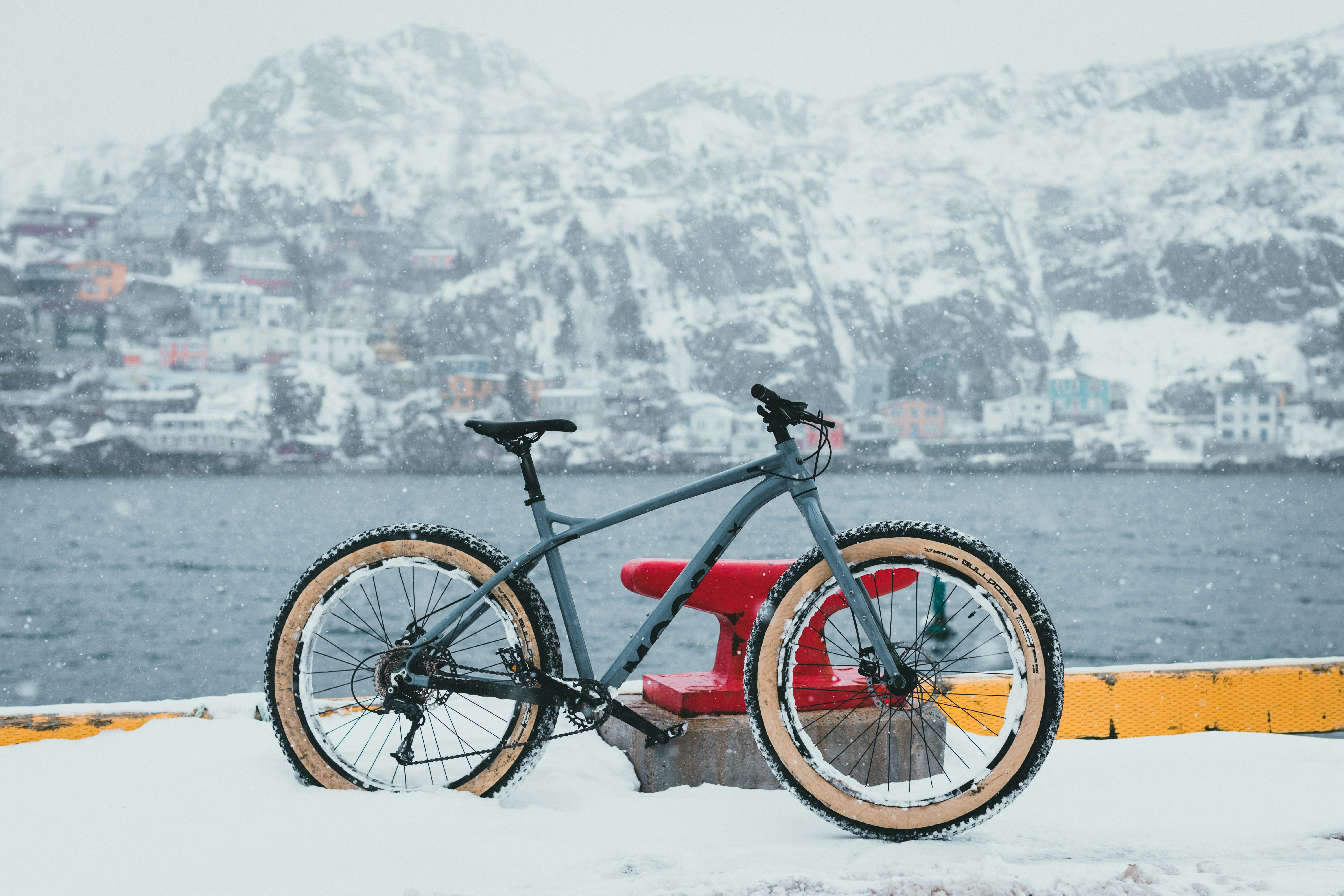 Blue Bicycle in a Snowbound Harbor: A Quiet Winter Stop
