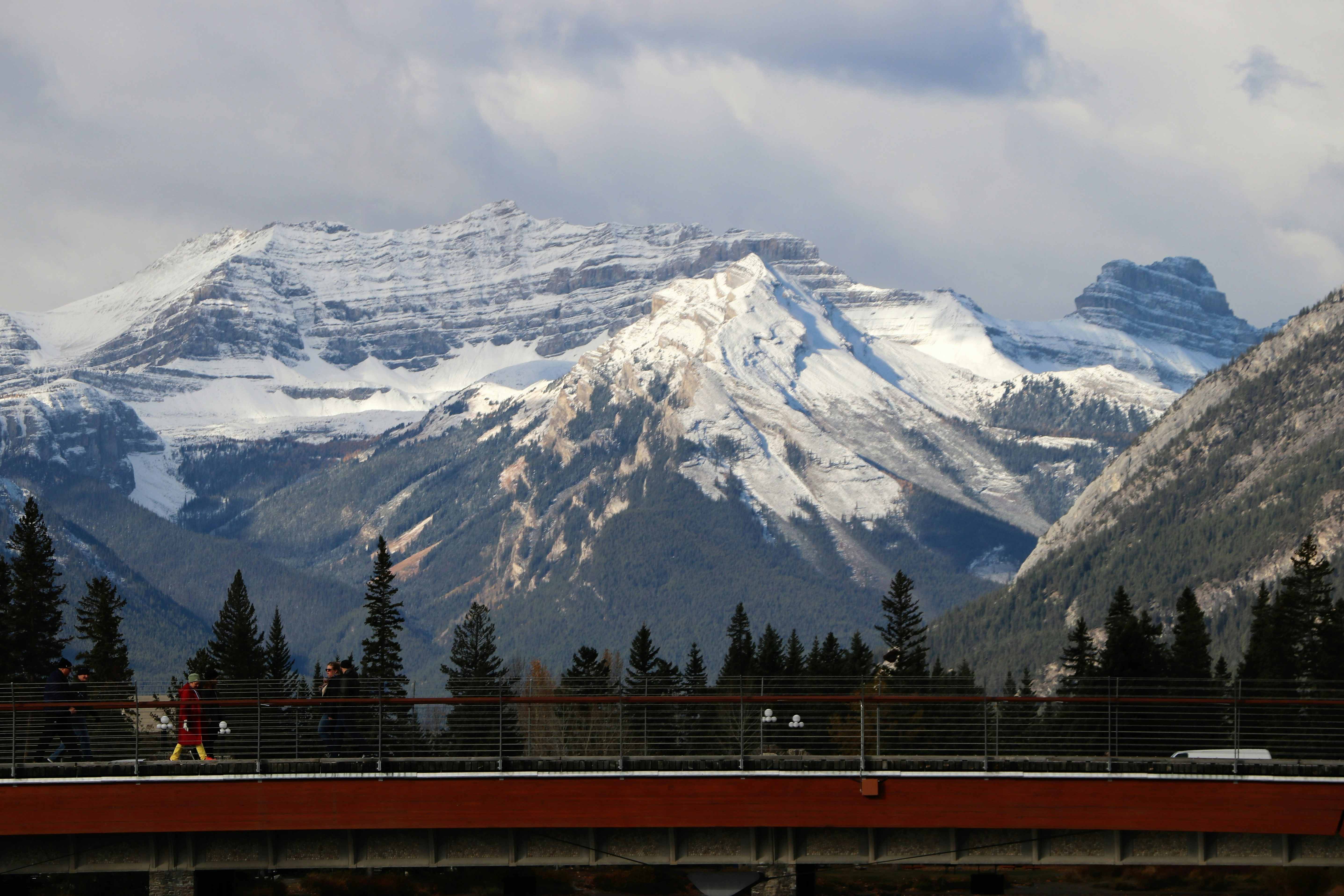 a view of a mountain range from a bridge