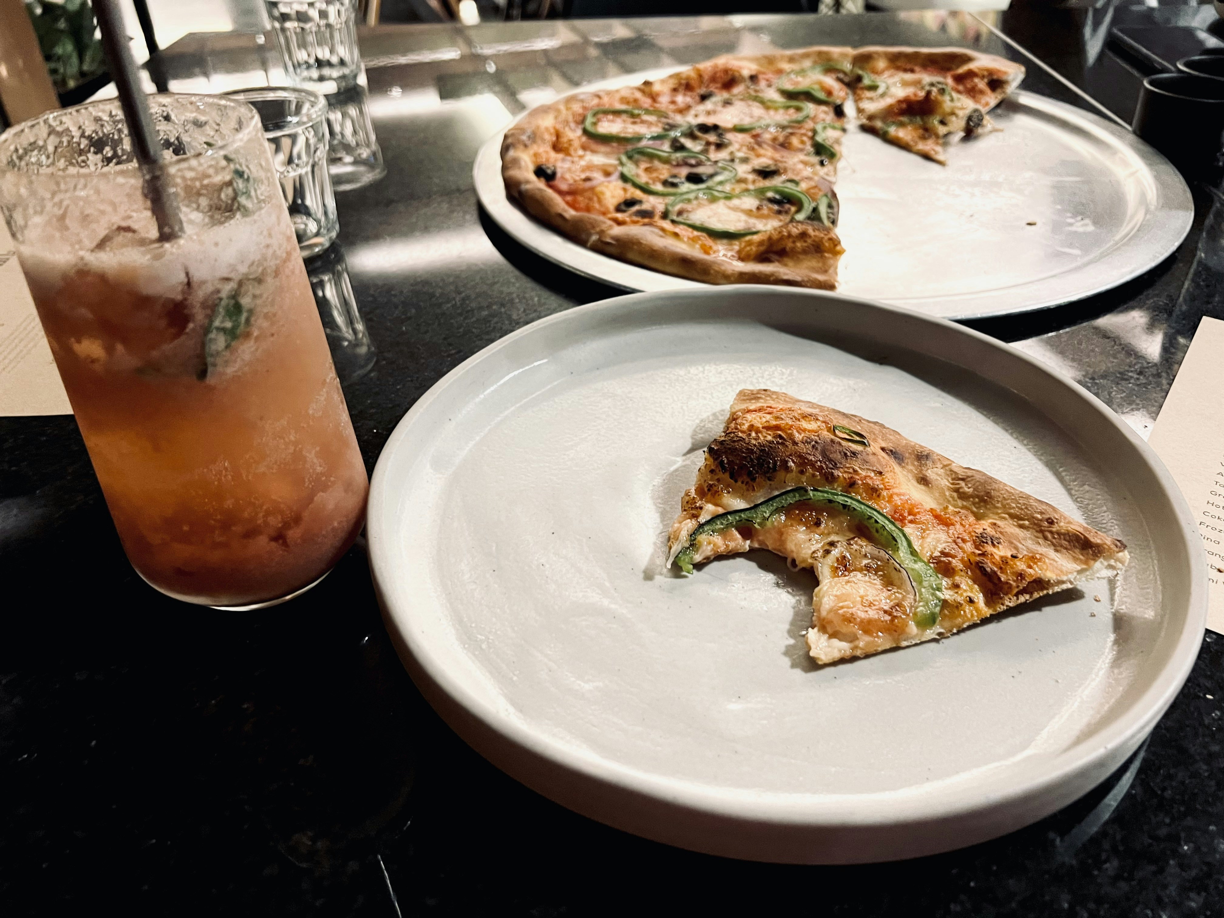 Foreground Slice in Focus: A Quiet Pizza Moment on the Counter