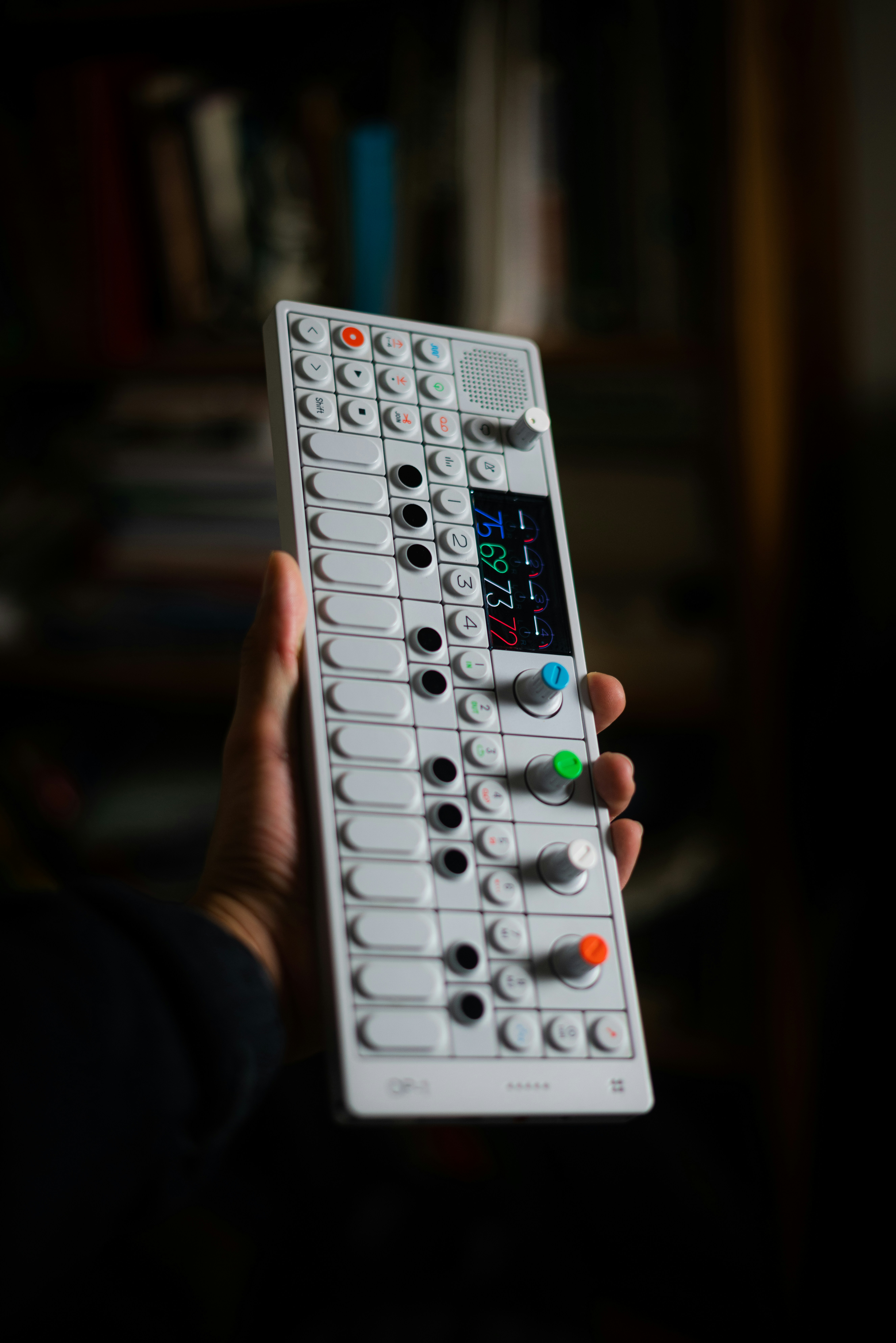 A person holding a remote control in their hand photo – Free Grey Image ...