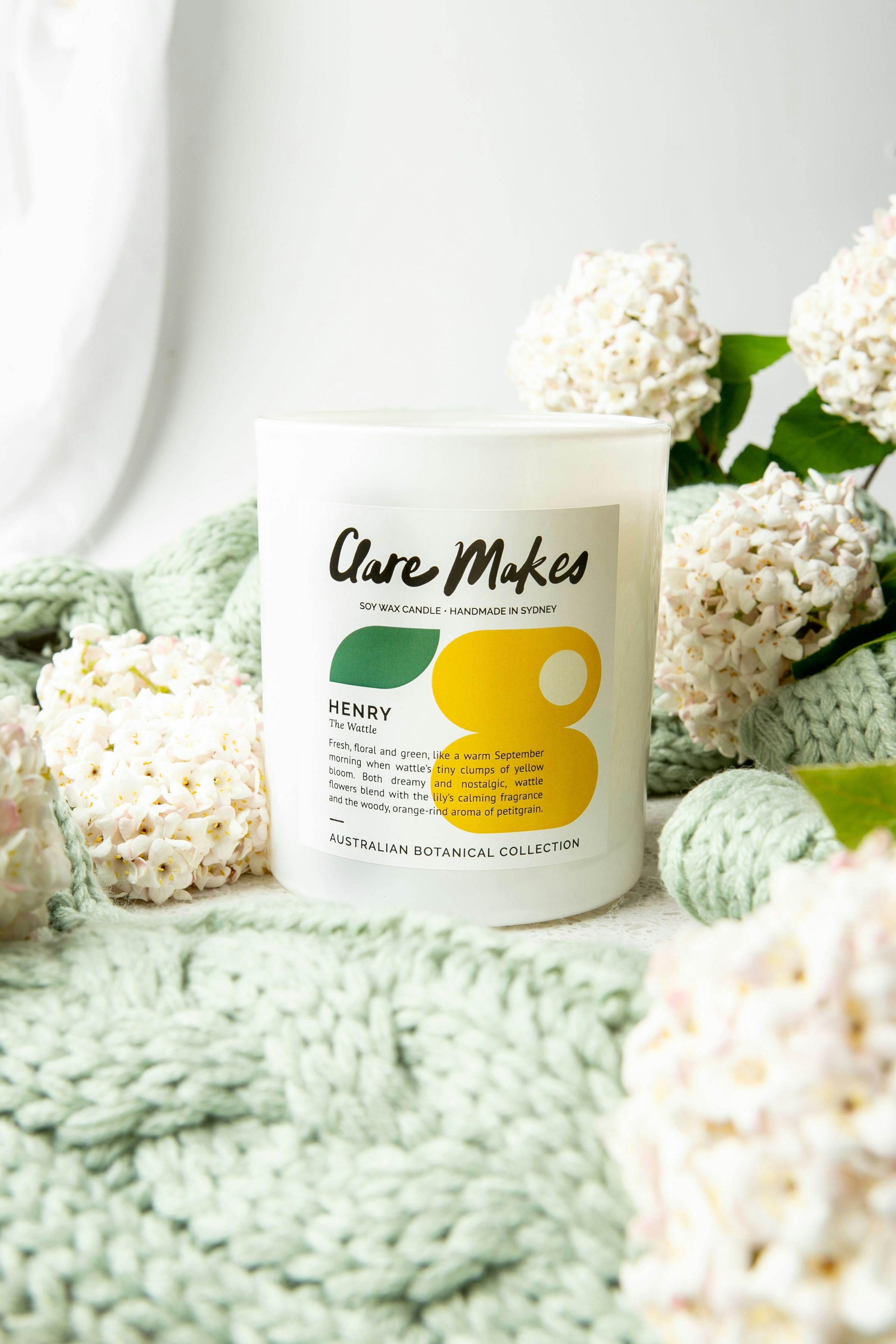 Candle in a Soft Garden: A Clean Still-Life Moment