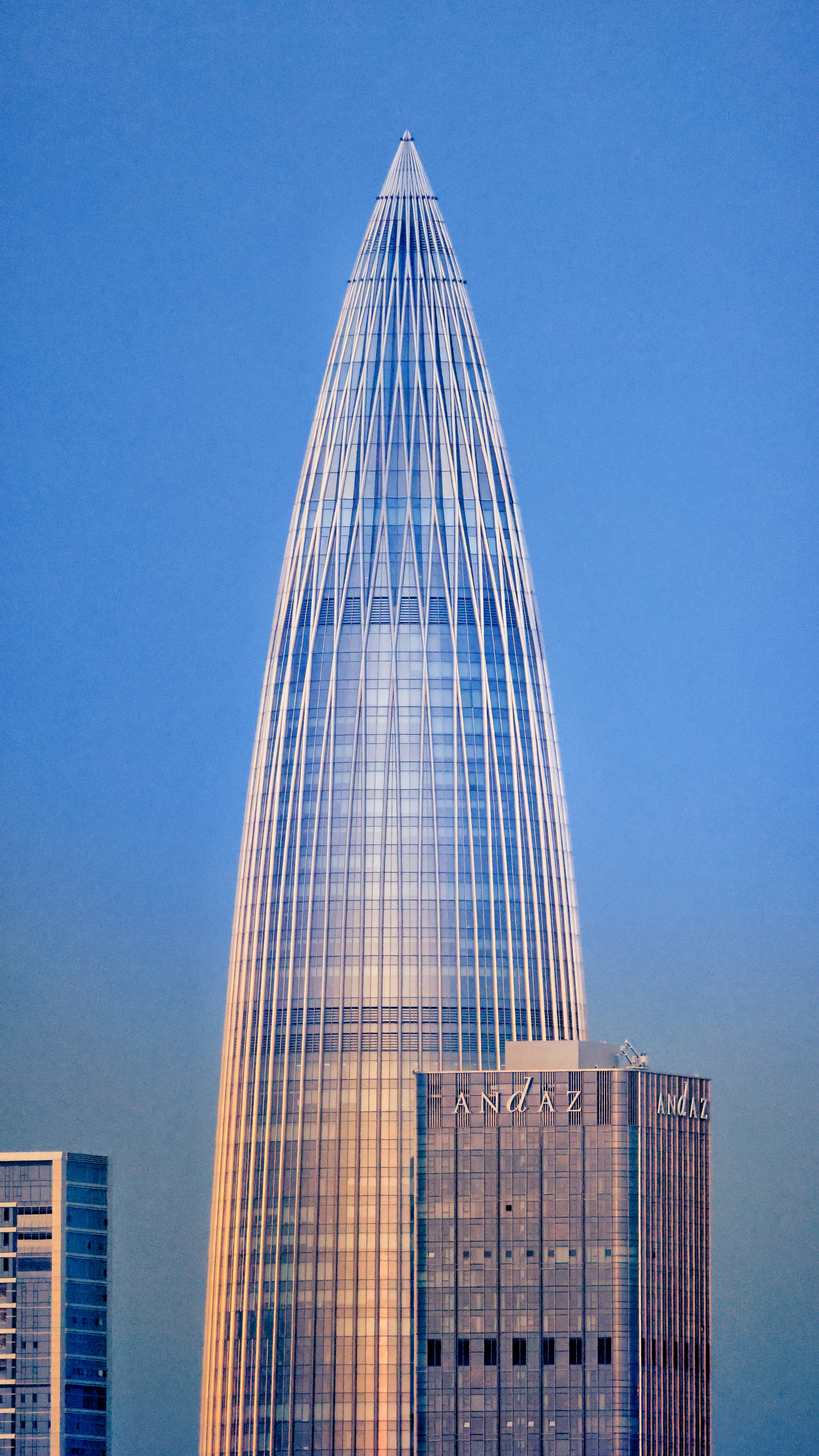 A very tall building sitting next to a tall building photo – Free 南山区 ...