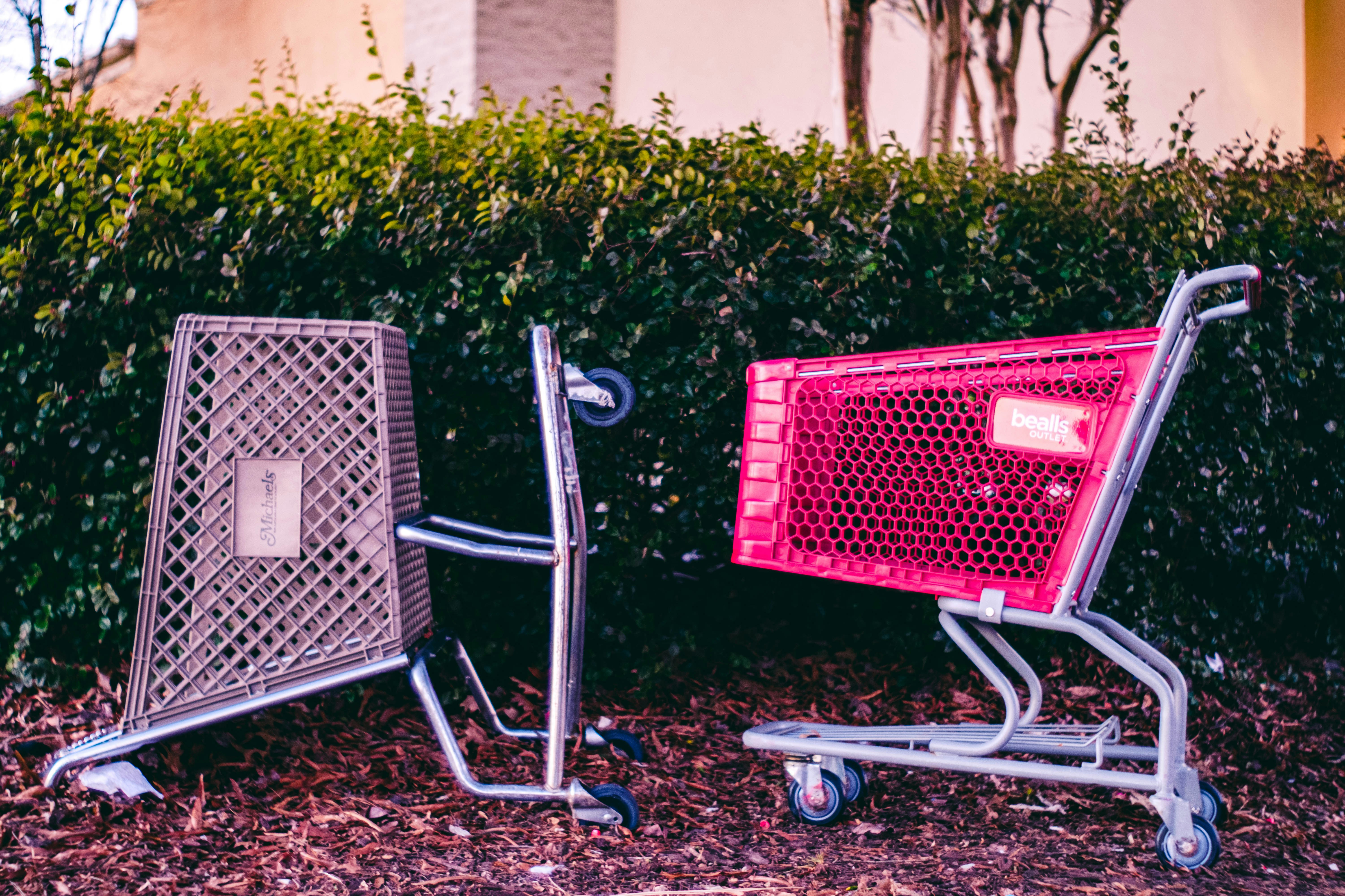 A couple of shopping carts sitting next to each other photo – Free ...