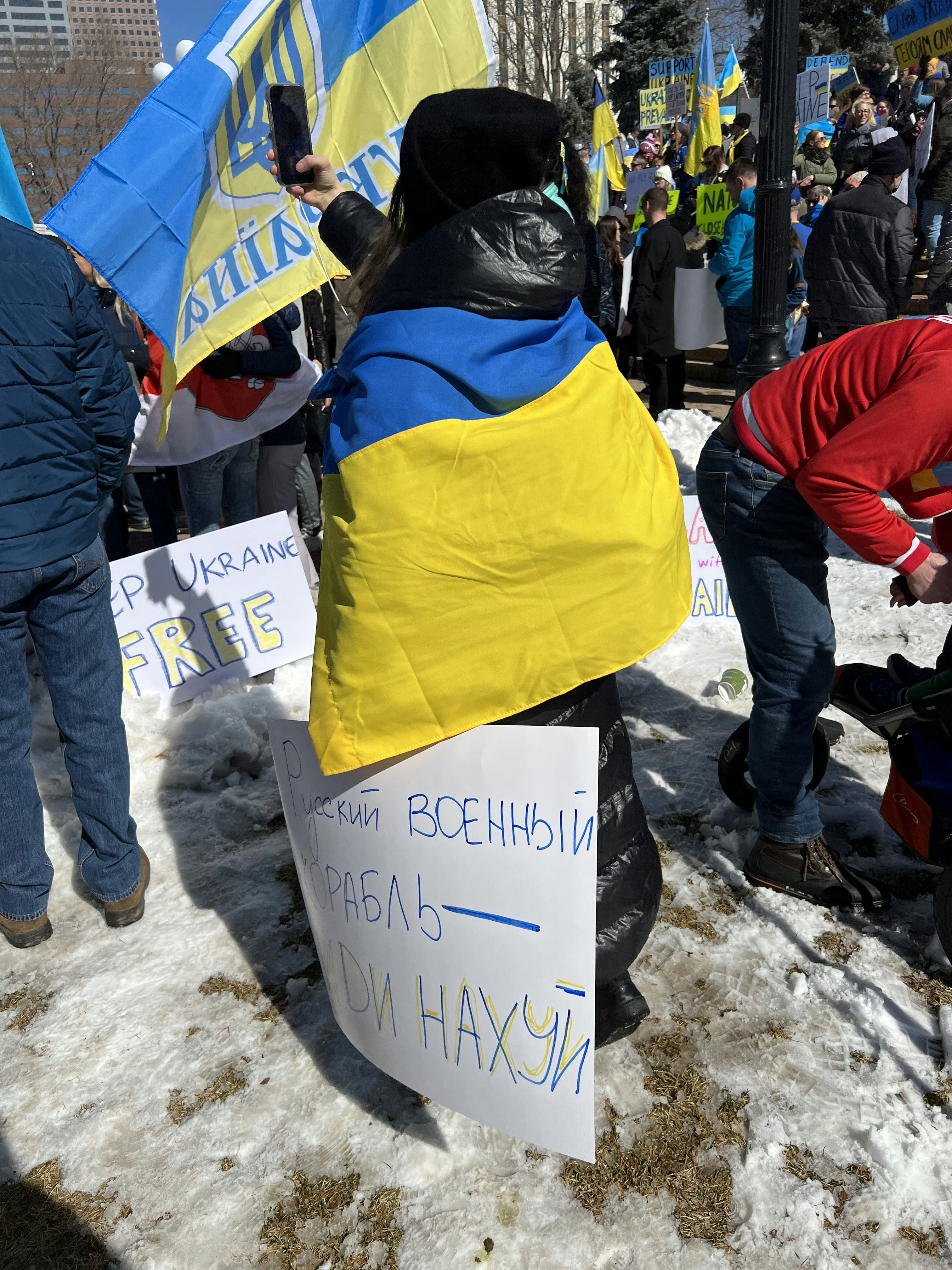 Flag-Wrapped Figure in a Snowy Ukraine Solidarity Rally