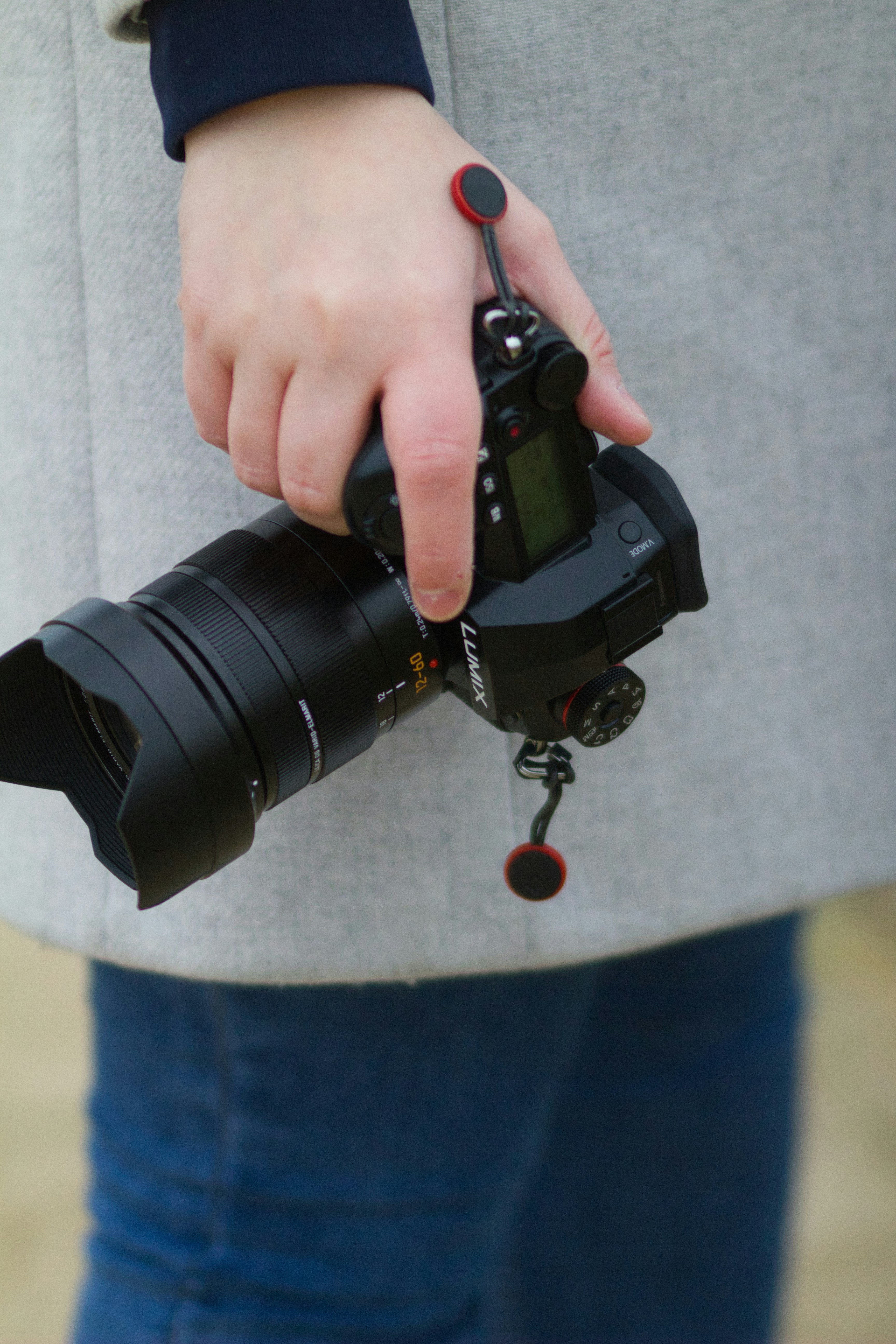 a person is holding a camera and taking a picture