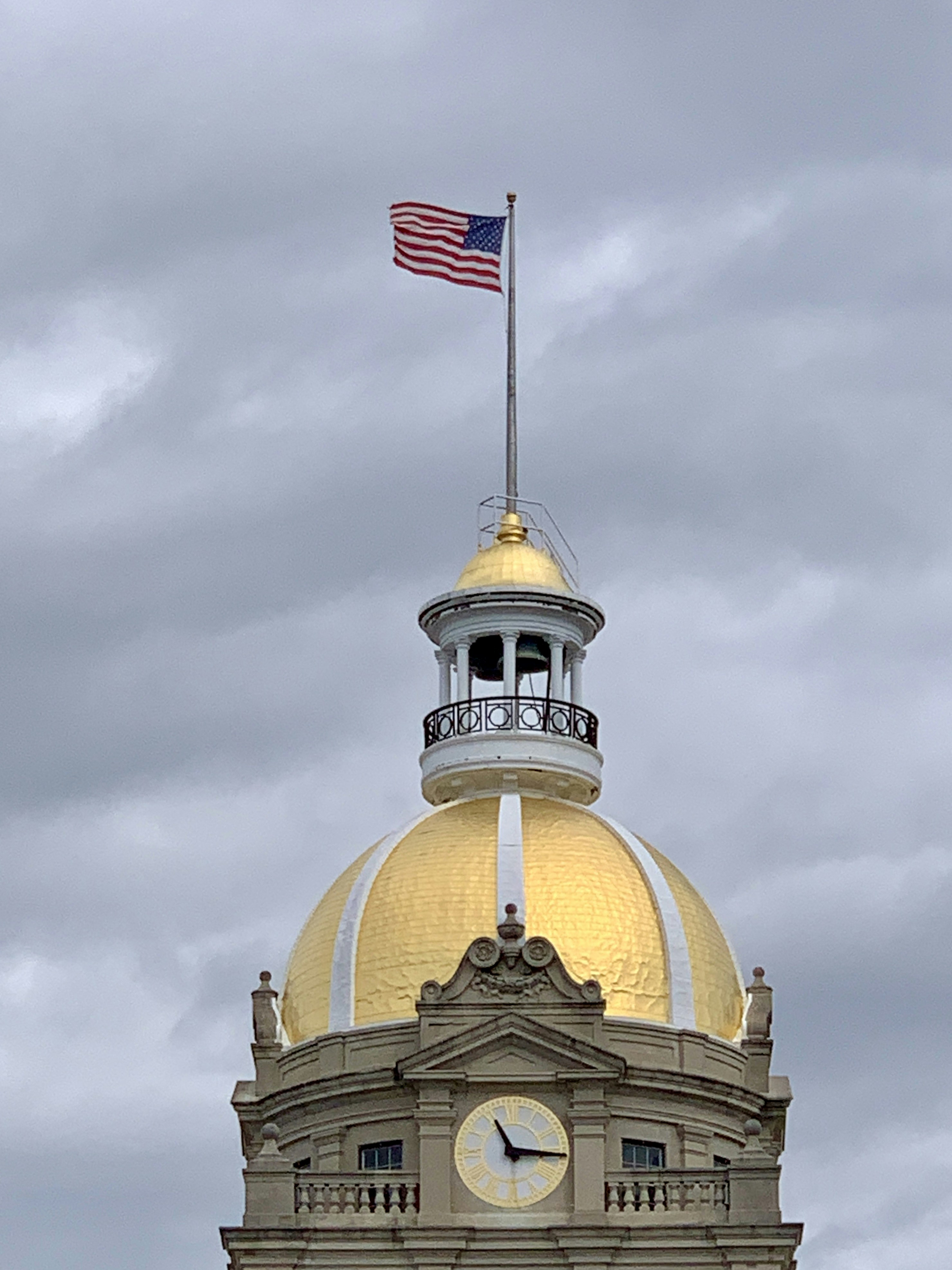 Flag Over the Gilded Dome: A Neoclassical Beacon Under a Stormy Sky