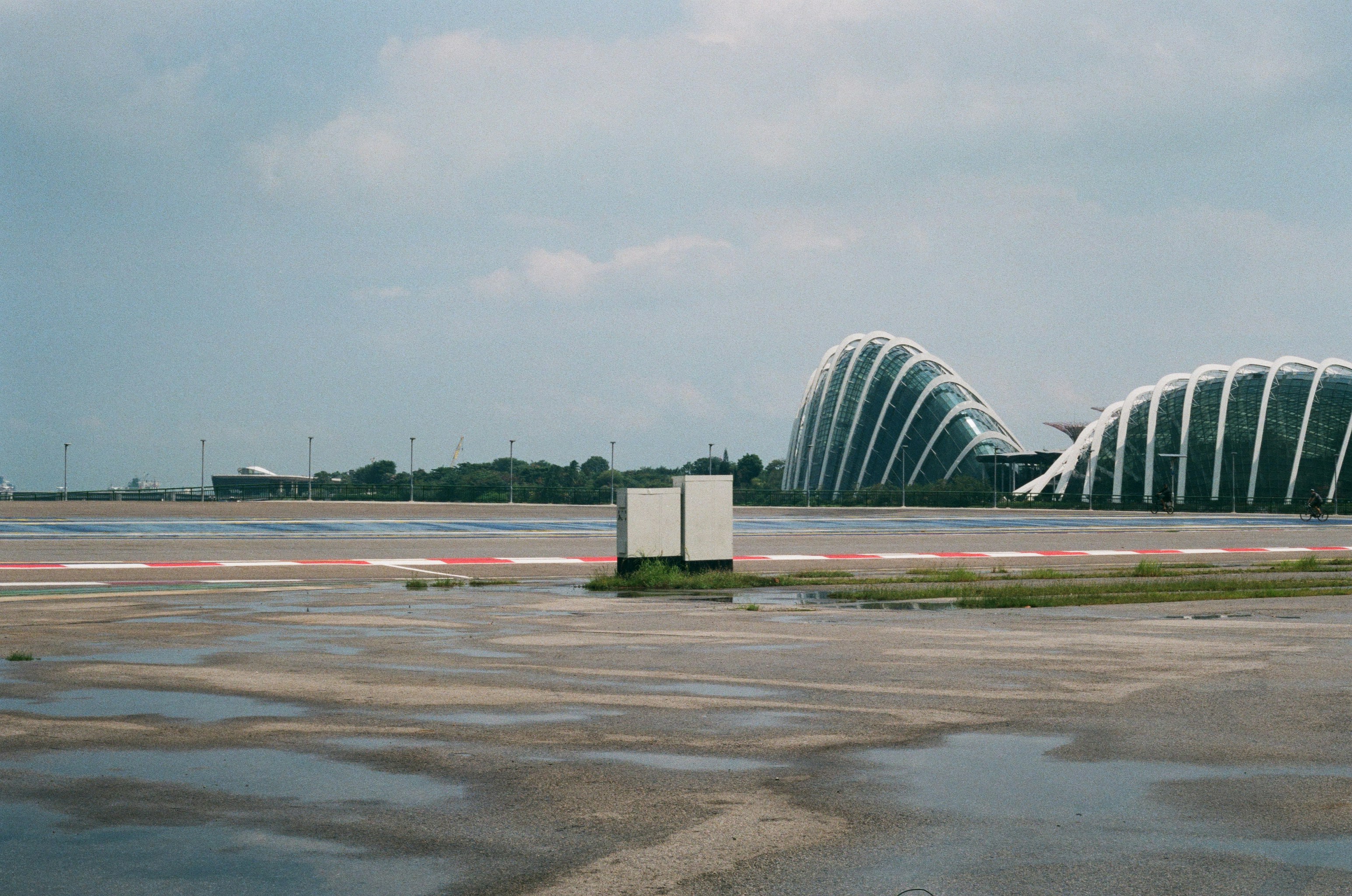 A large building sitting on top of an airport tarmac photo – Free ...