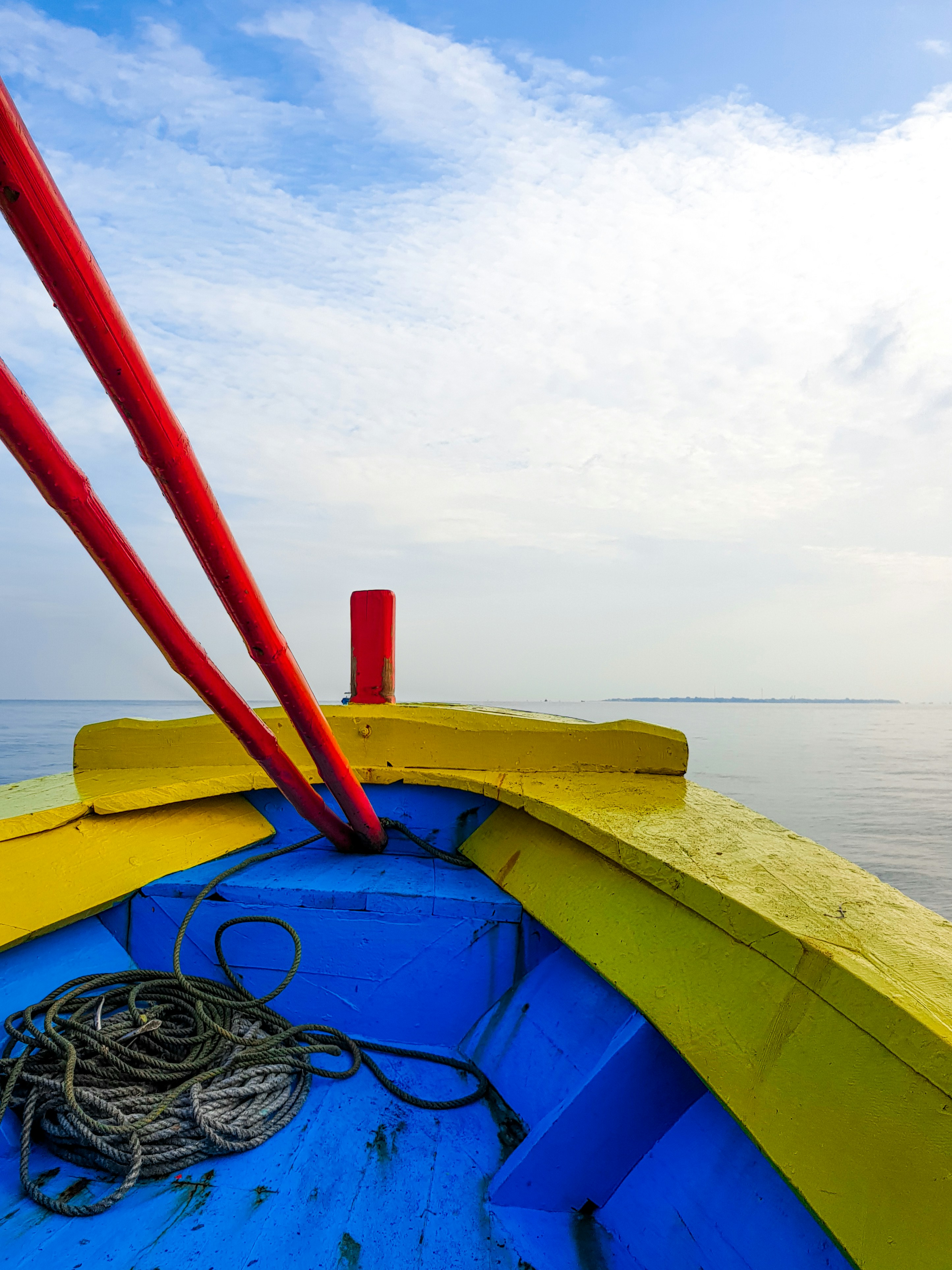 A blue and yellow boat in the water photo – Free Water Image on Unsplash