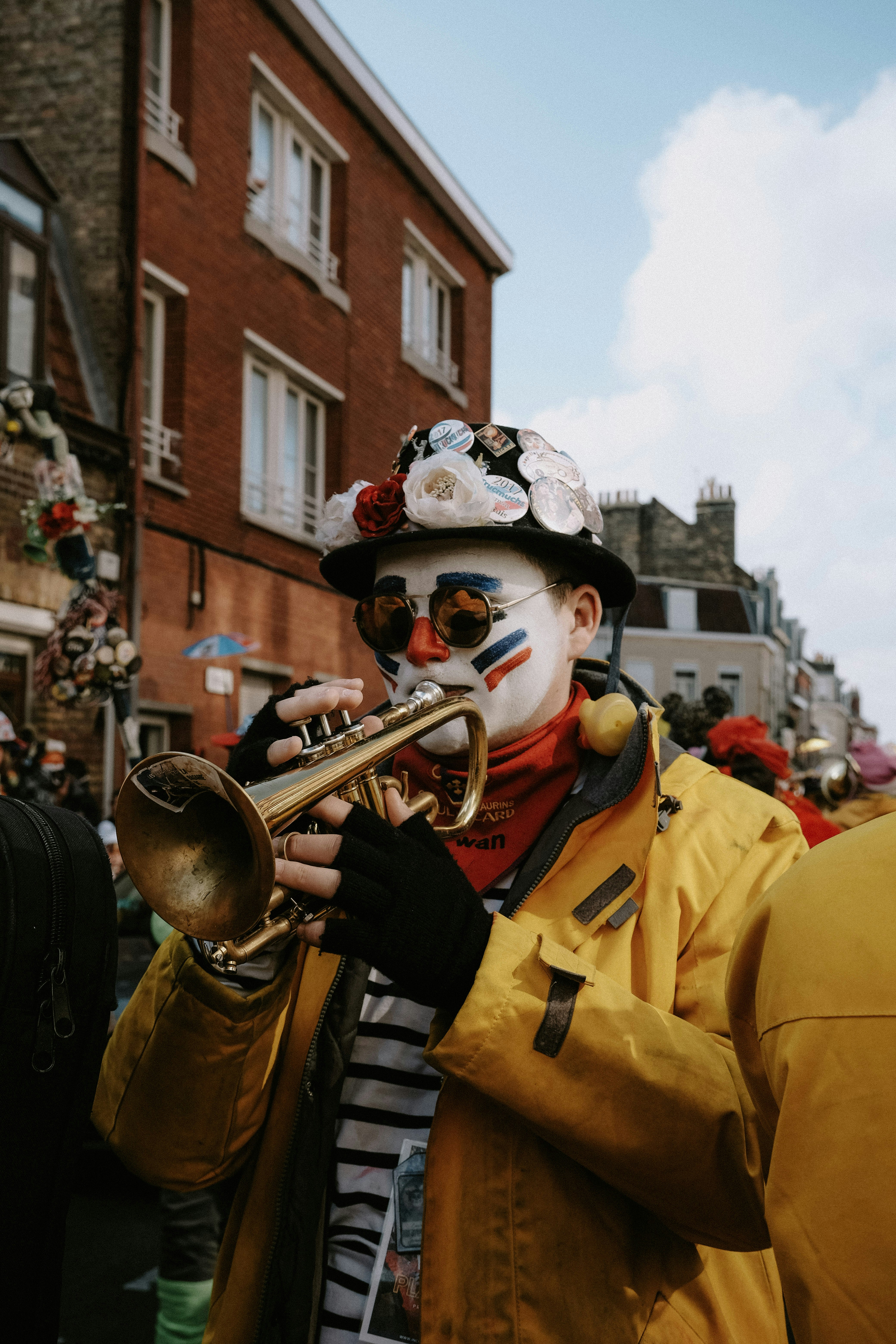 A man in clown makeup playing a trumpet photo – Free France Image on ...