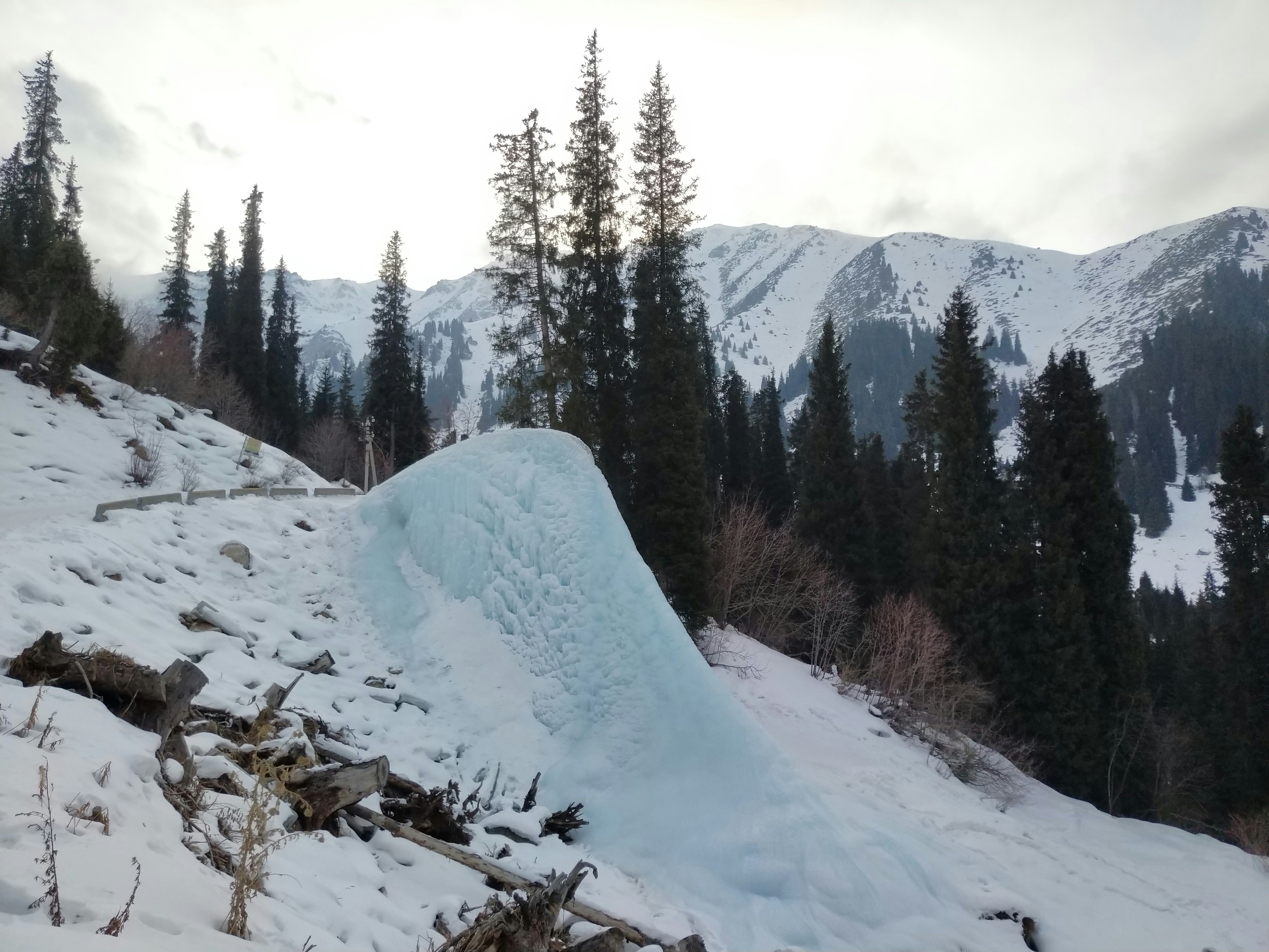 Blue Monolith on a Snow-Swept Alpine Slope