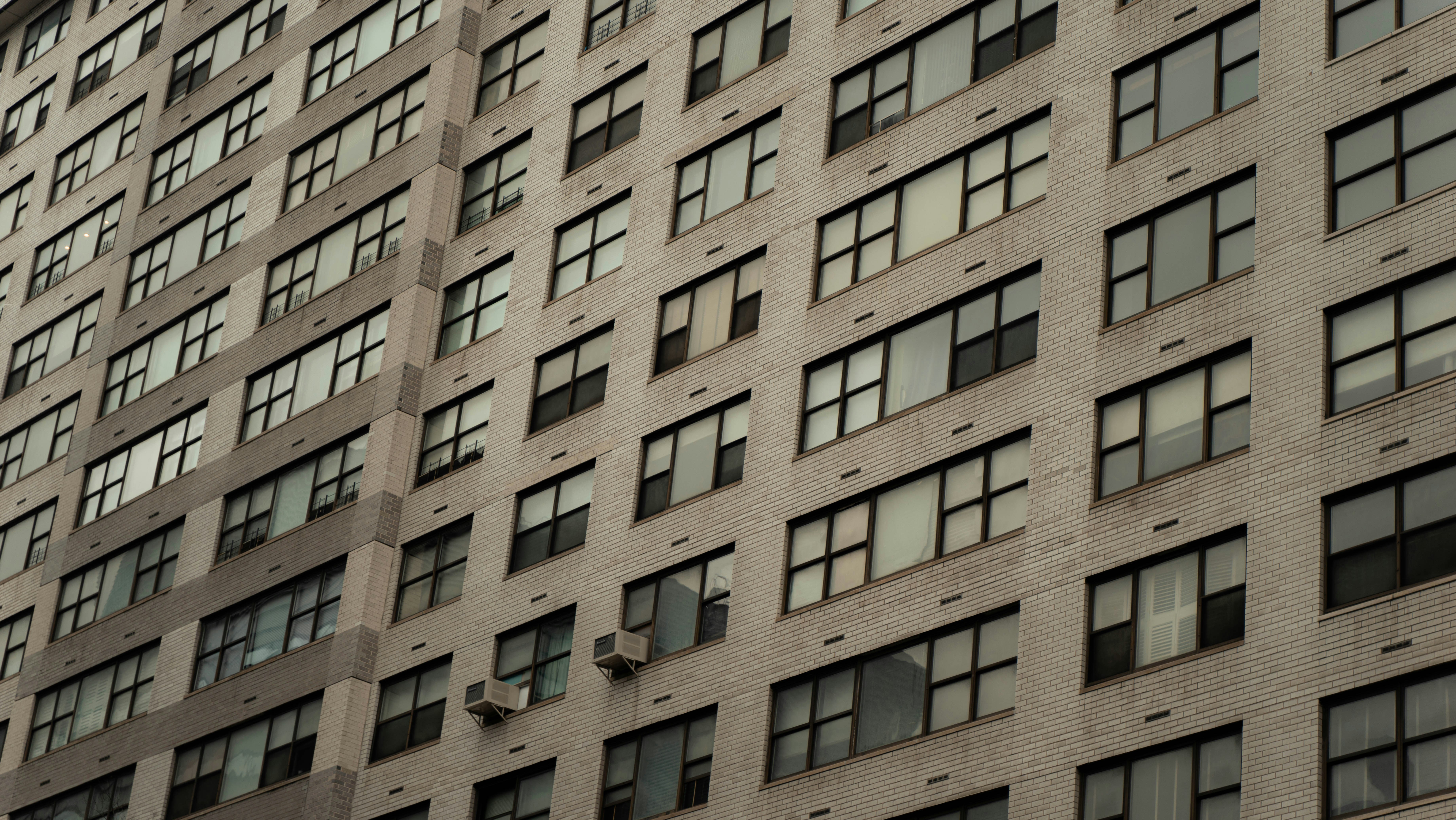 A very tall building with lots of windows photo – Free New york Image ...