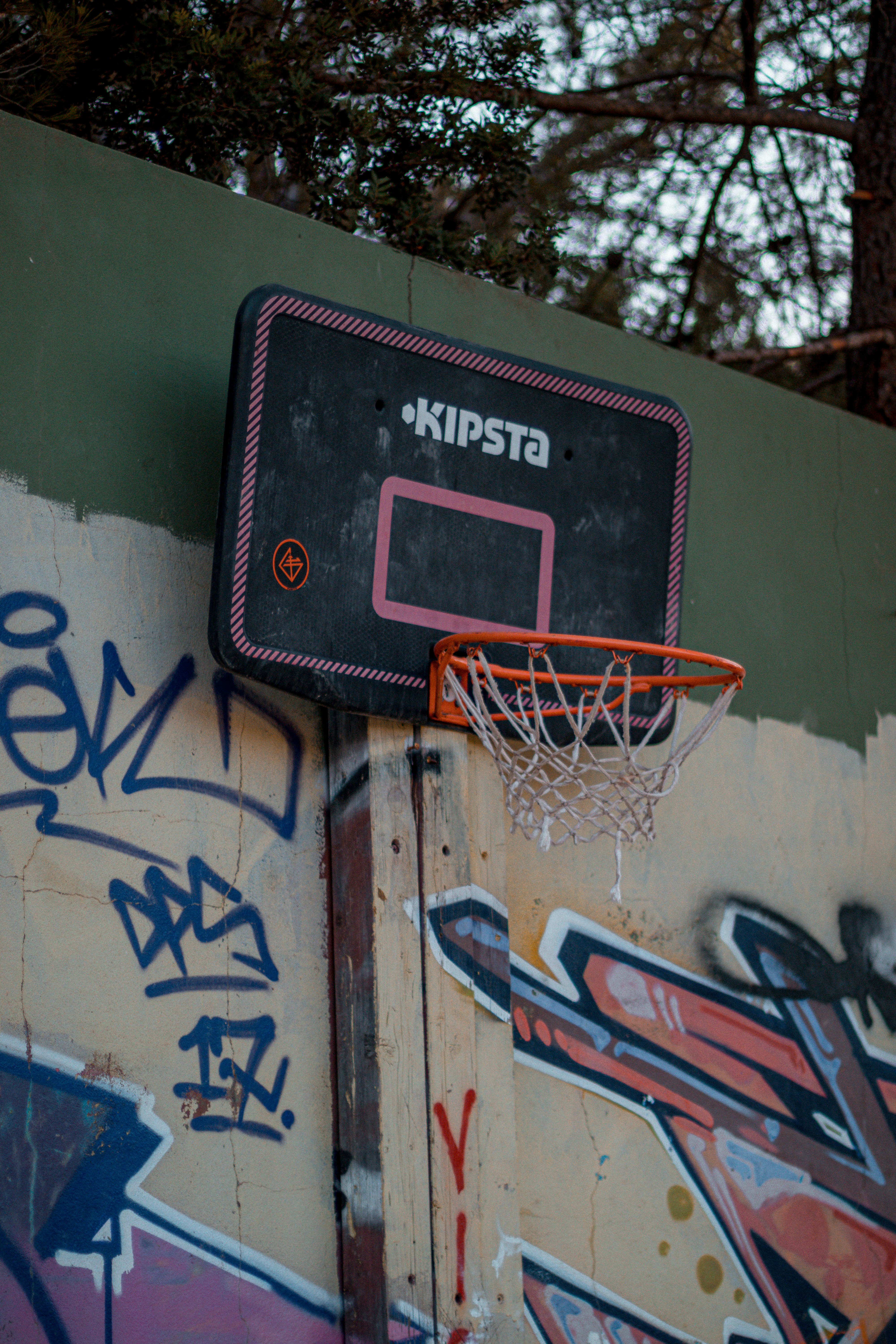 Graffiti Court Hoop: The Kipsta Backboard Amid Urban Color