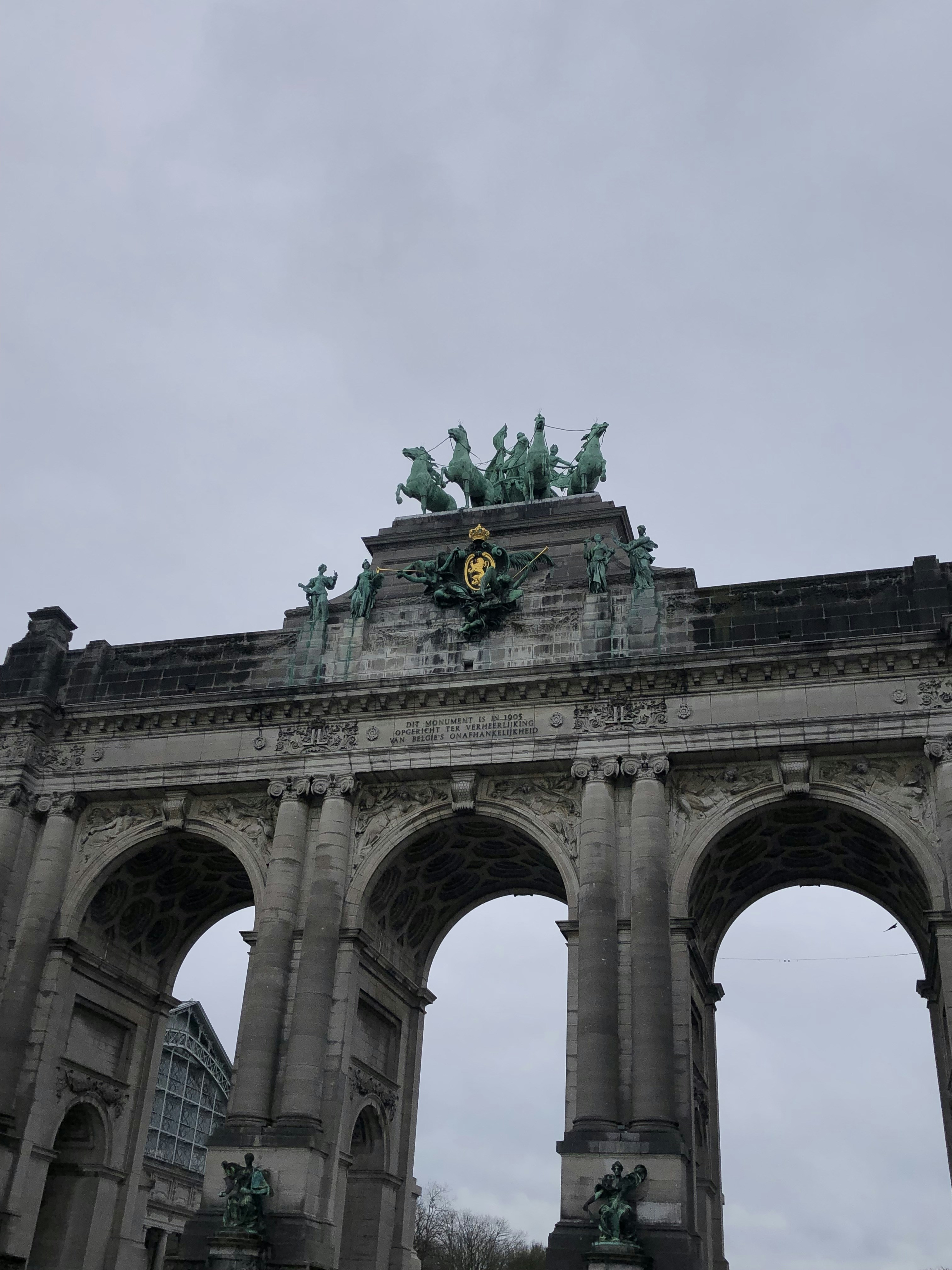 A large arch with statues on top of it photo – Free Belgium Image on ...