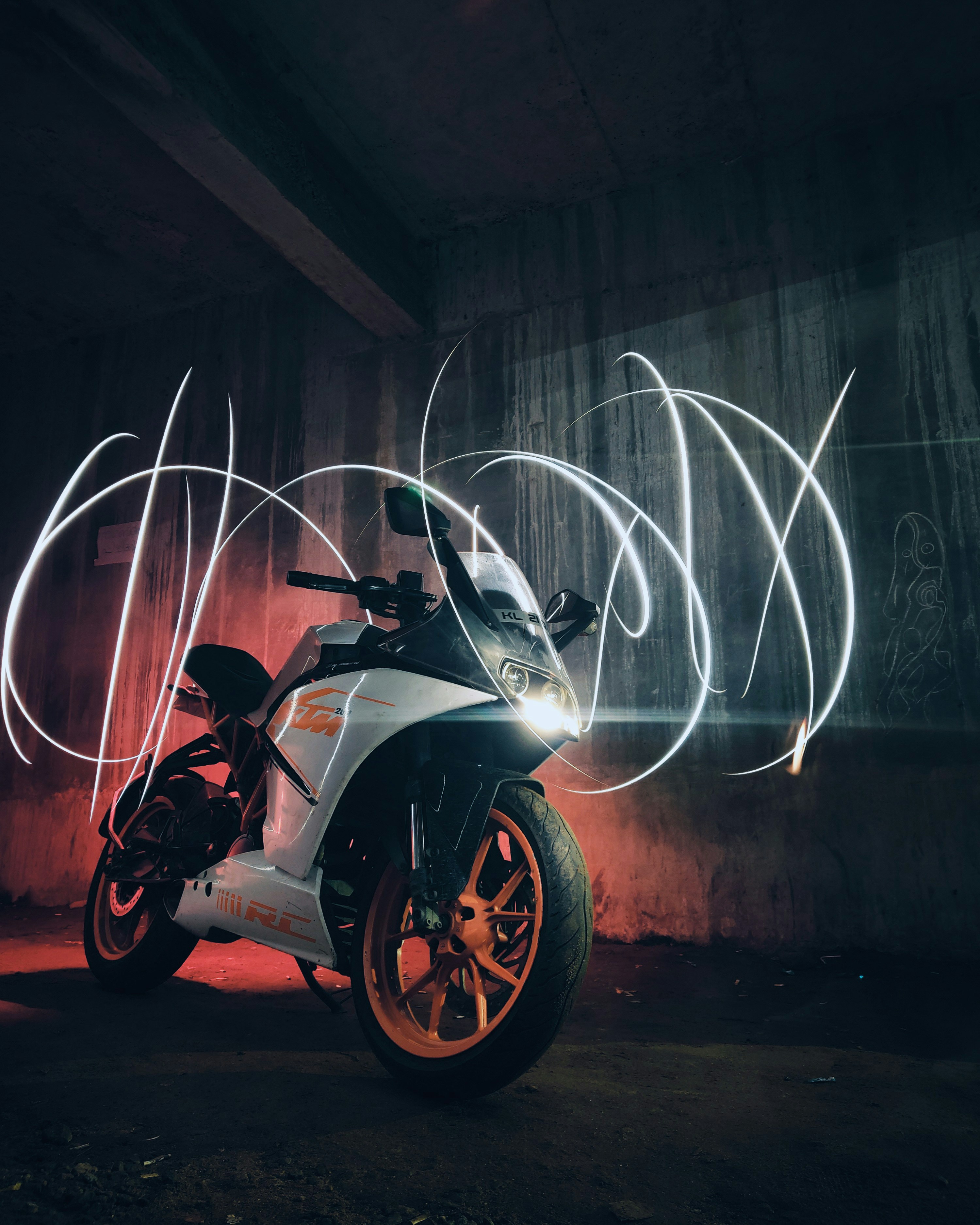 Neon Loops Embrace a White Sportbike in a Dark Garage